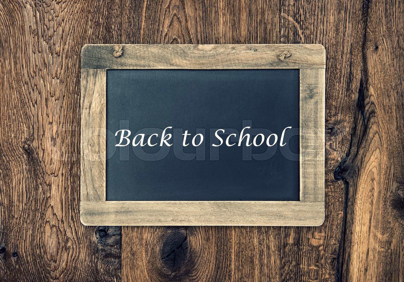 Vintage blackboard on wooden wall. Back to School | Stock image | Colourbox