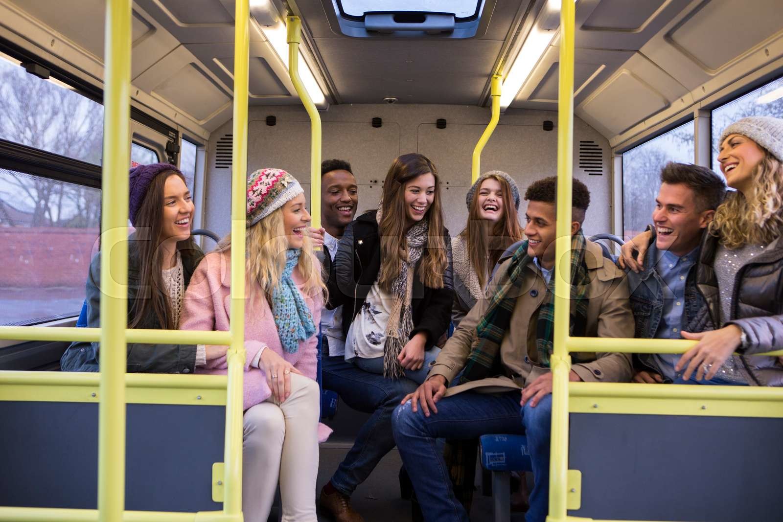 Young people travelling by bus together. | Stock image | Colourbox