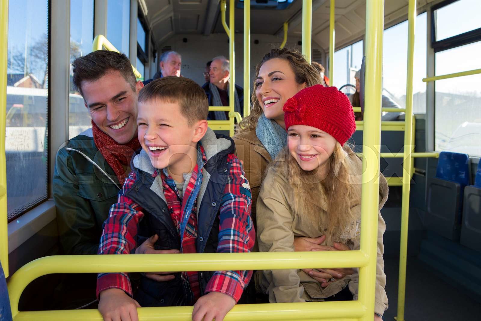 Happy family on the bus | Stock image | Colourbox