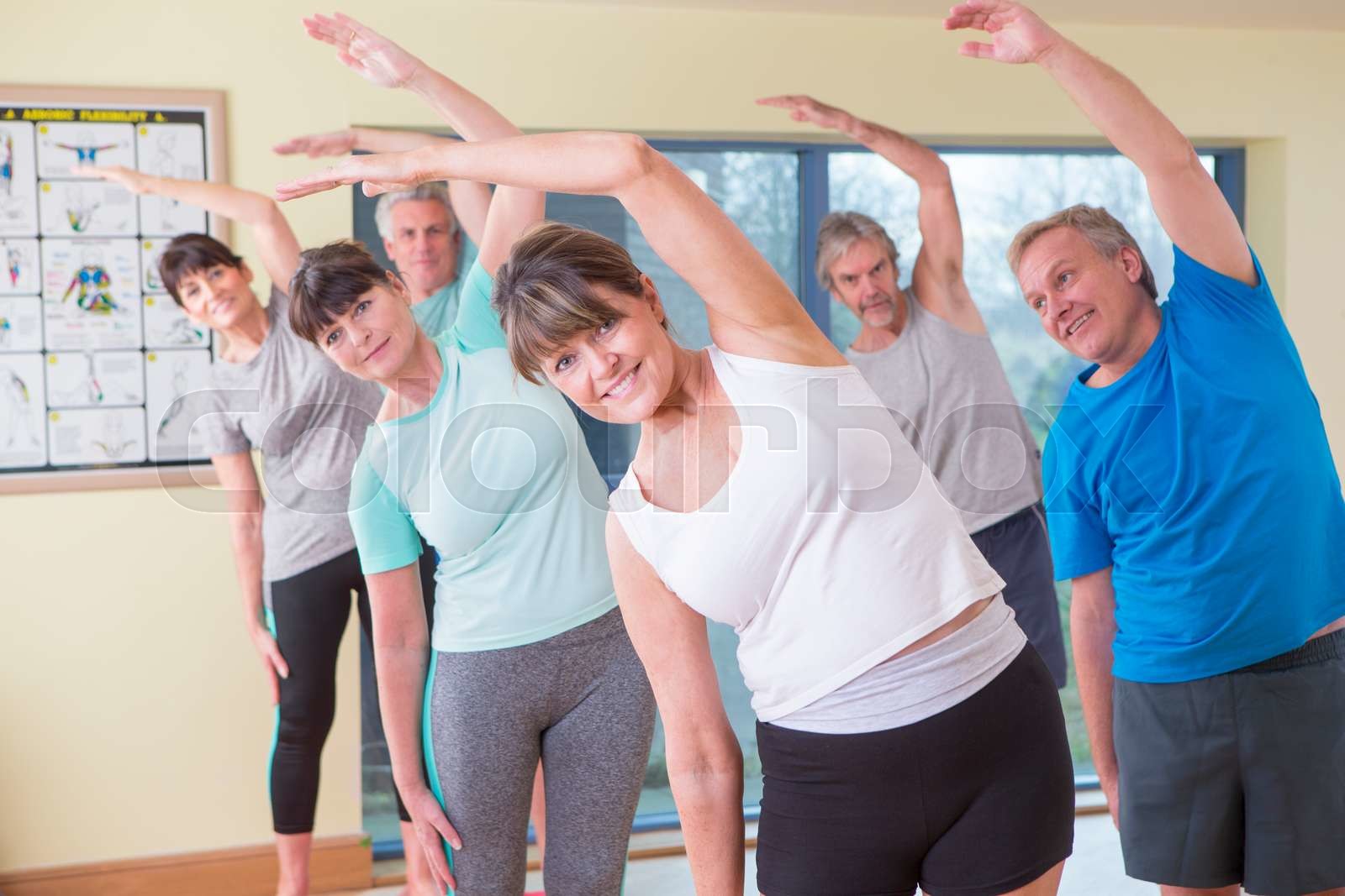Group of seniors stretching | Stock image | Colourbox