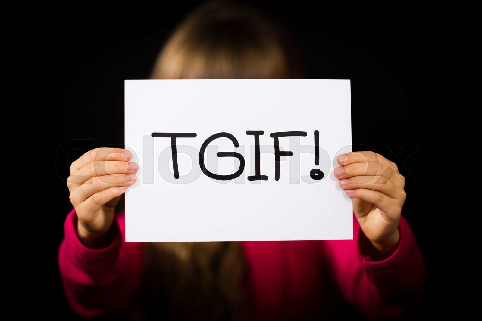 Child holding TGIF sign | Stock image | Colourbox
