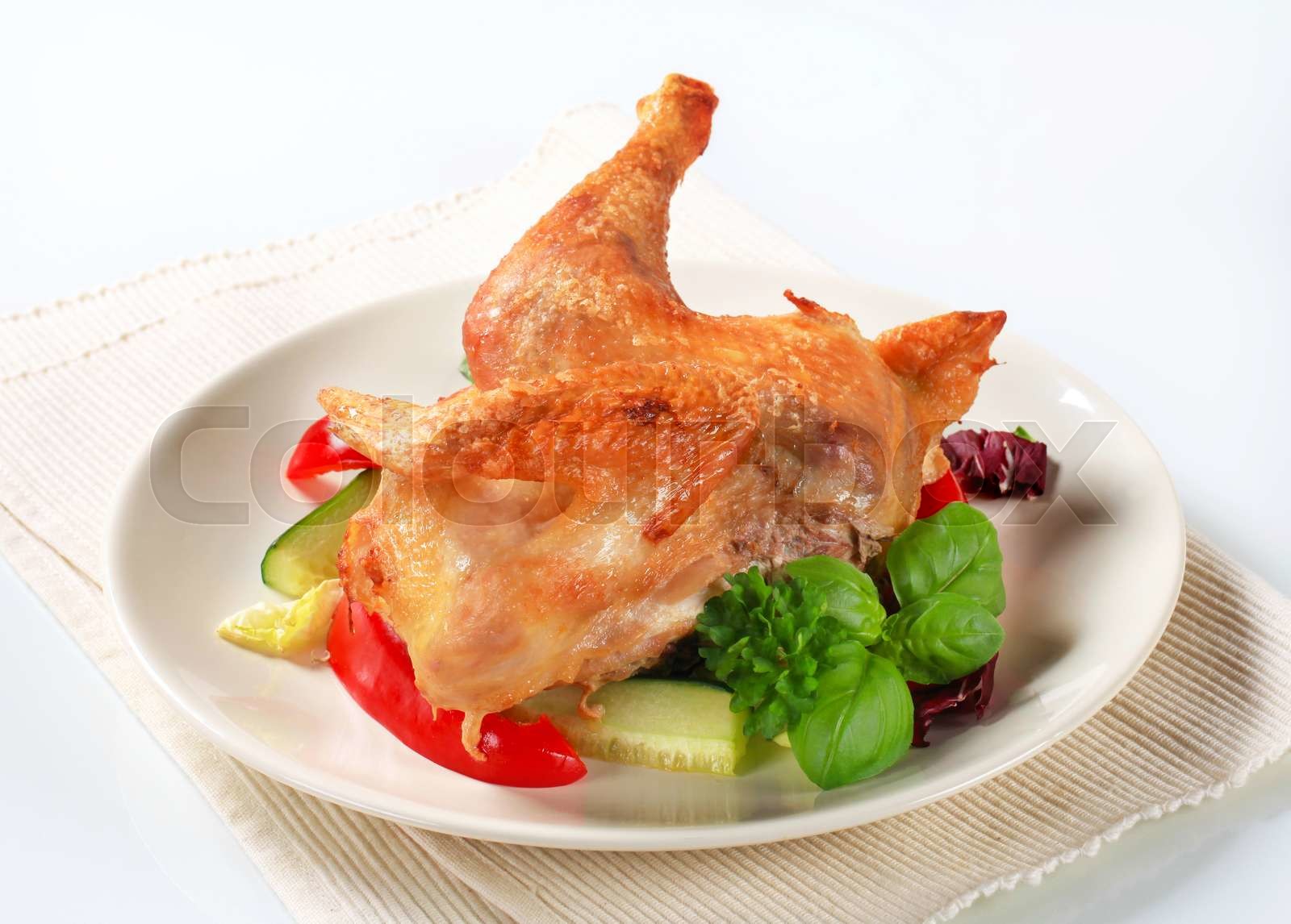 Roast chicken with vegetable garnish | Stock image | Colourbox