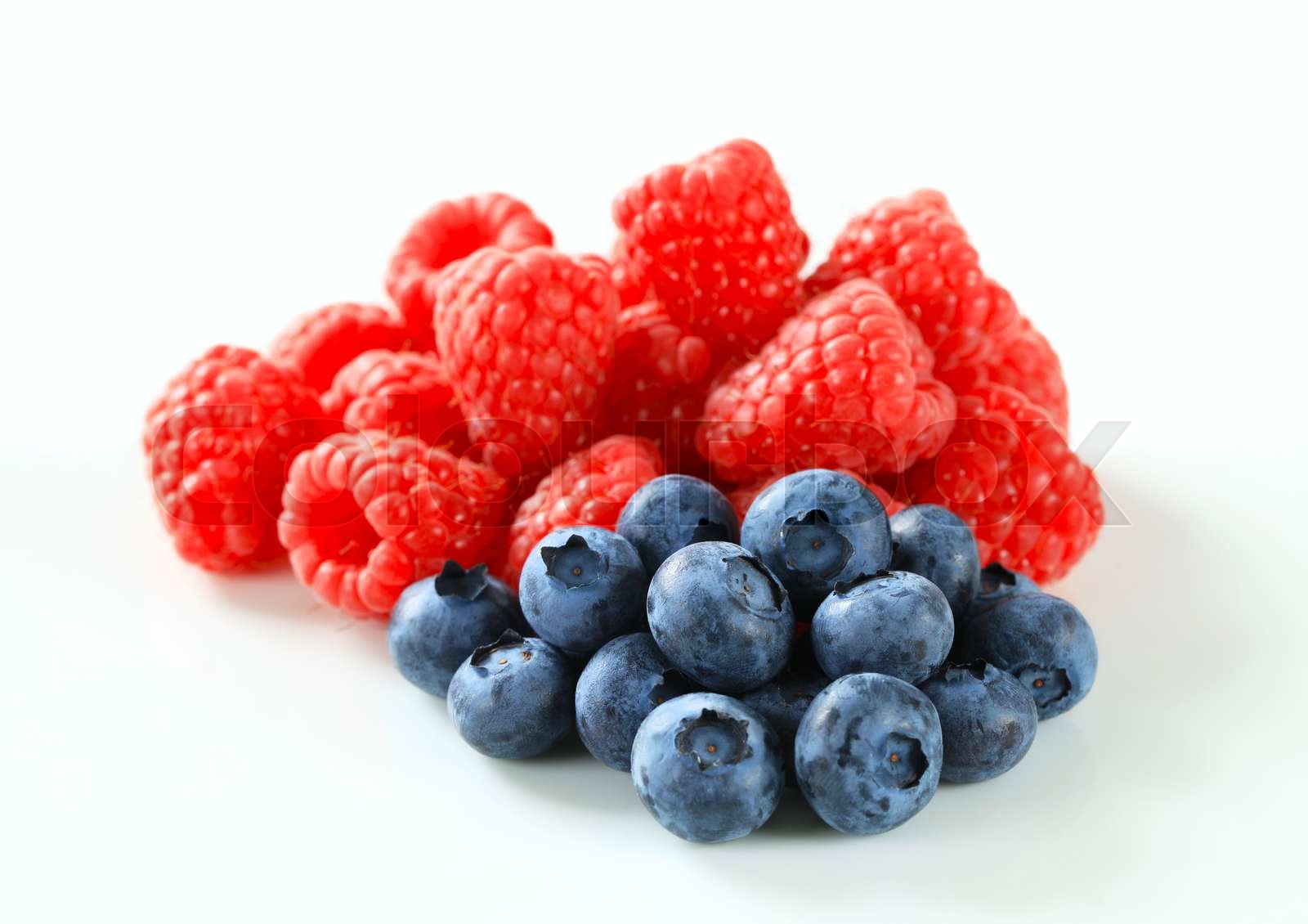 Fresh raspberries and blueberries | Stock image | Colourbox
