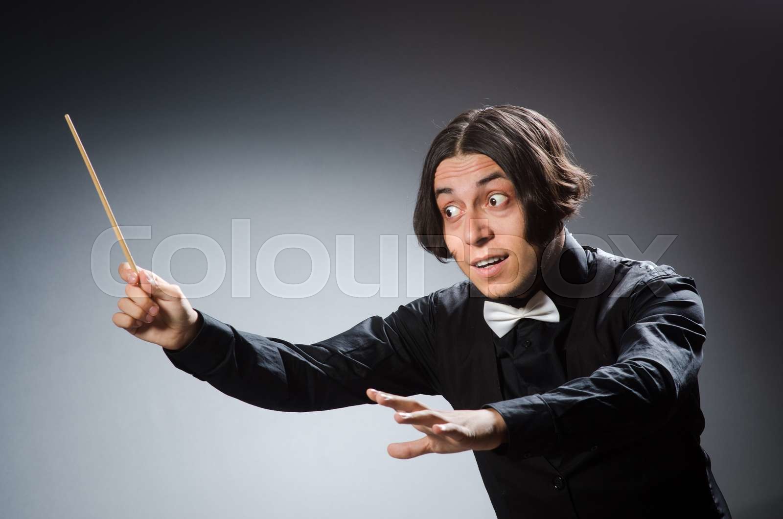 Funny conductor in musical concept | Stock image | Colourbox