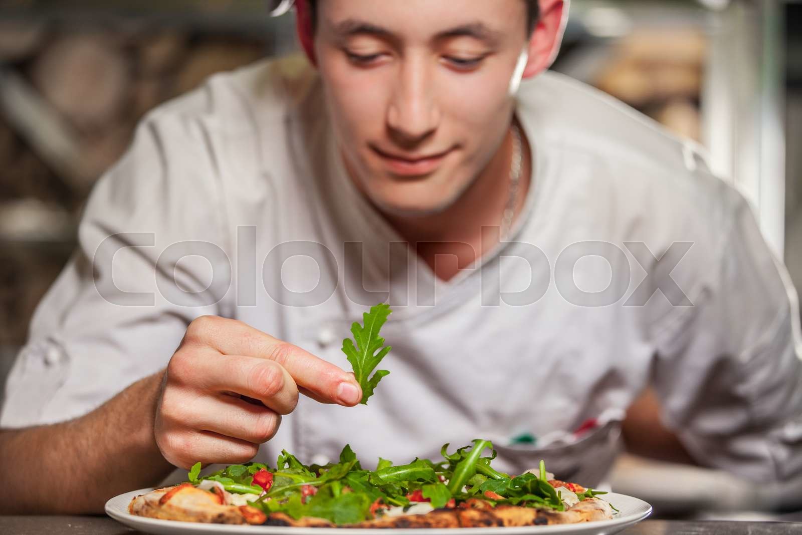 male cook preparing delicious appetizer | Stock image | Colourbox
