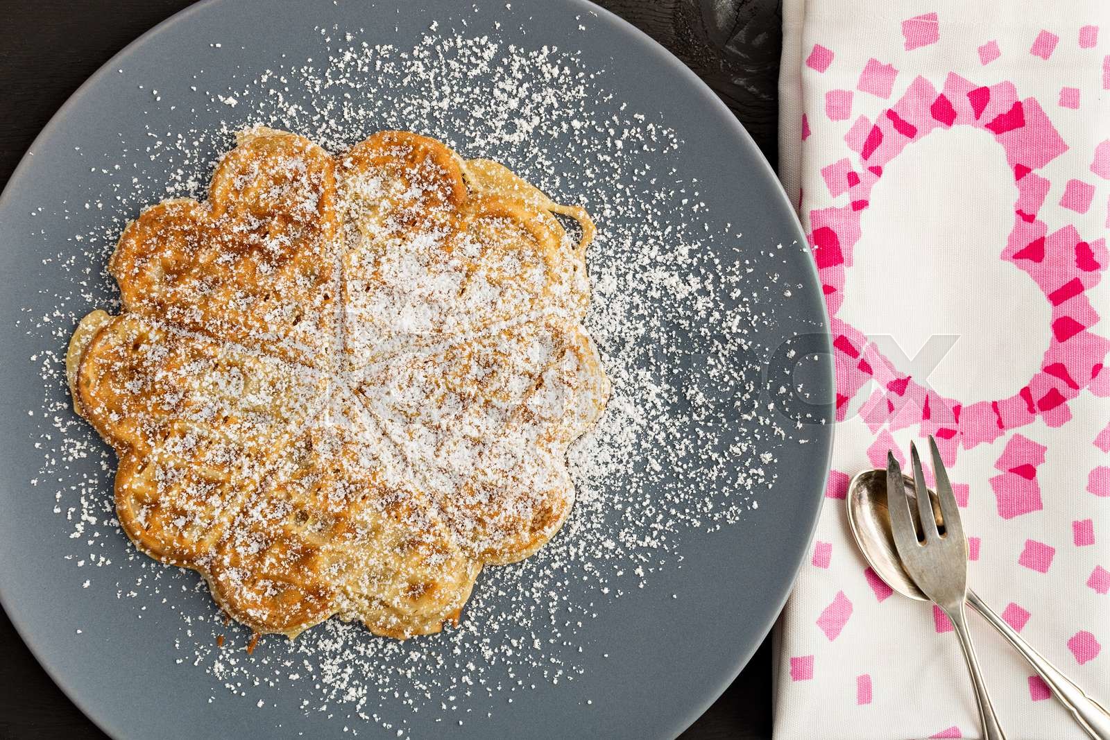 Hot waffle with powdered sugar | Stock image | Colourbox