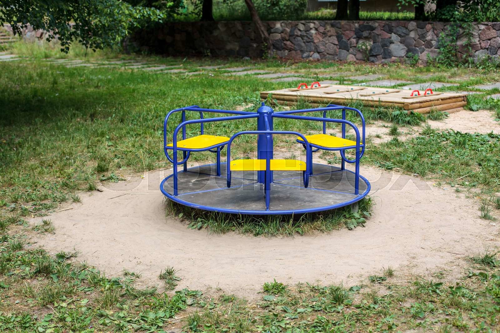 Empty roundabout in playground | Stock image | Colourbox