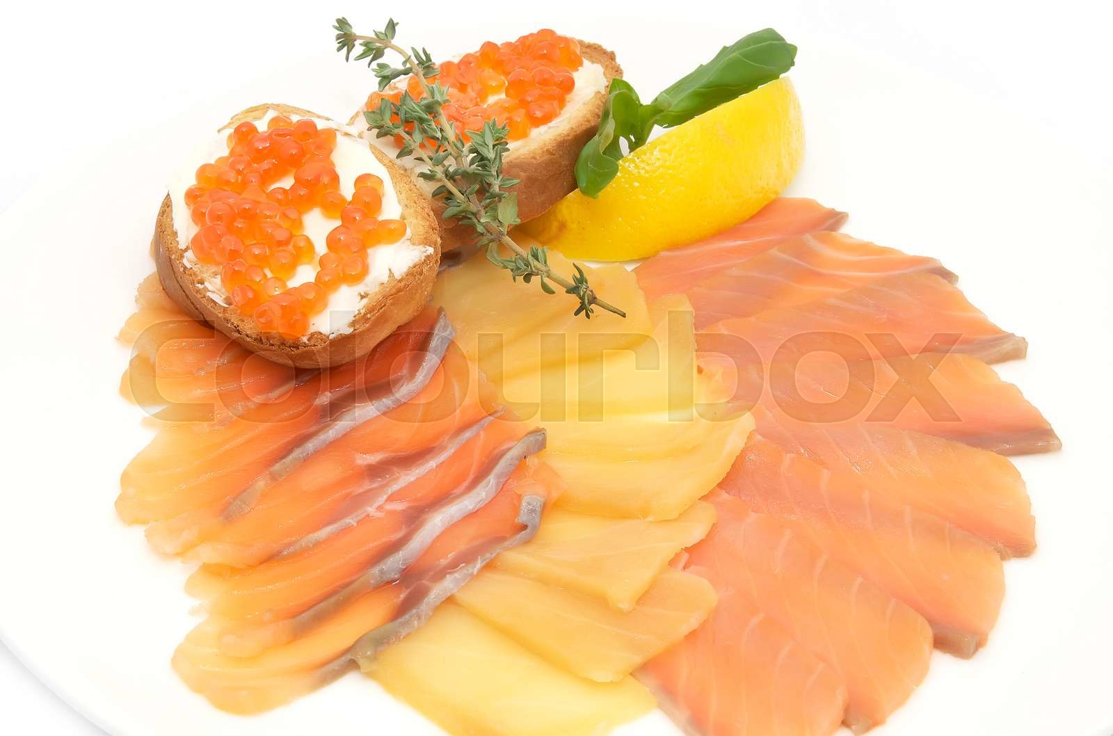 slicing fish and sandwiches with caviar | Stock image | Colourbox