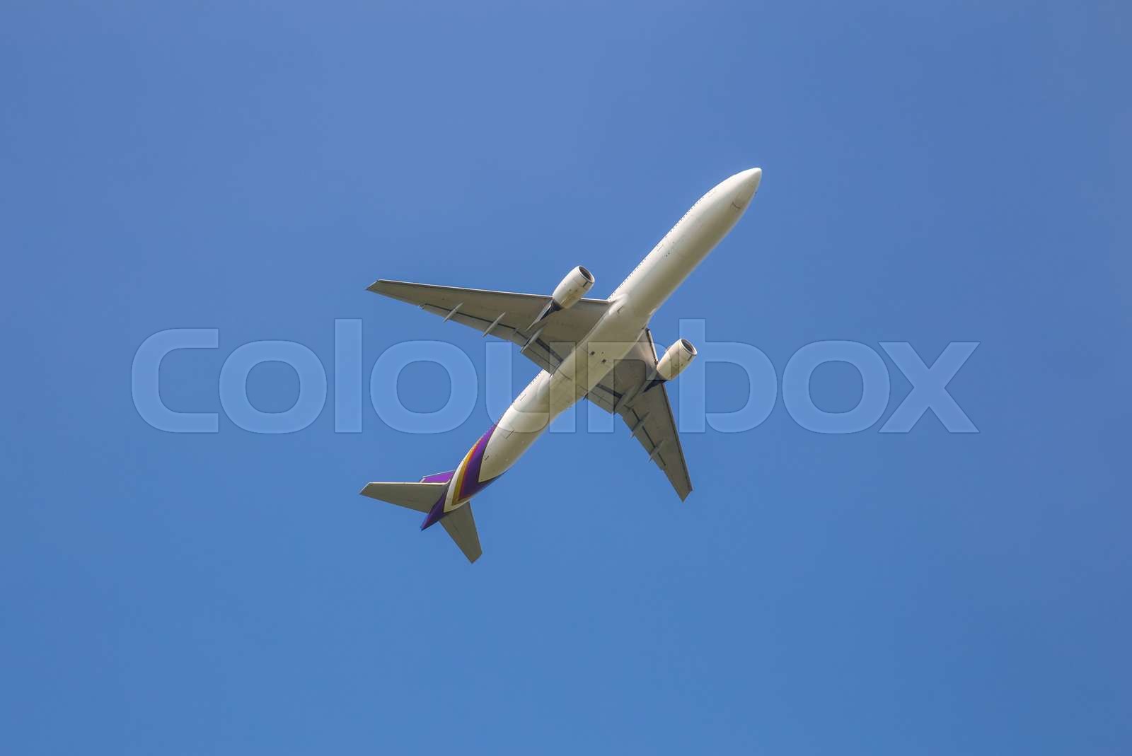 Airplane taking off at sky blue | Stock image | Colourbox