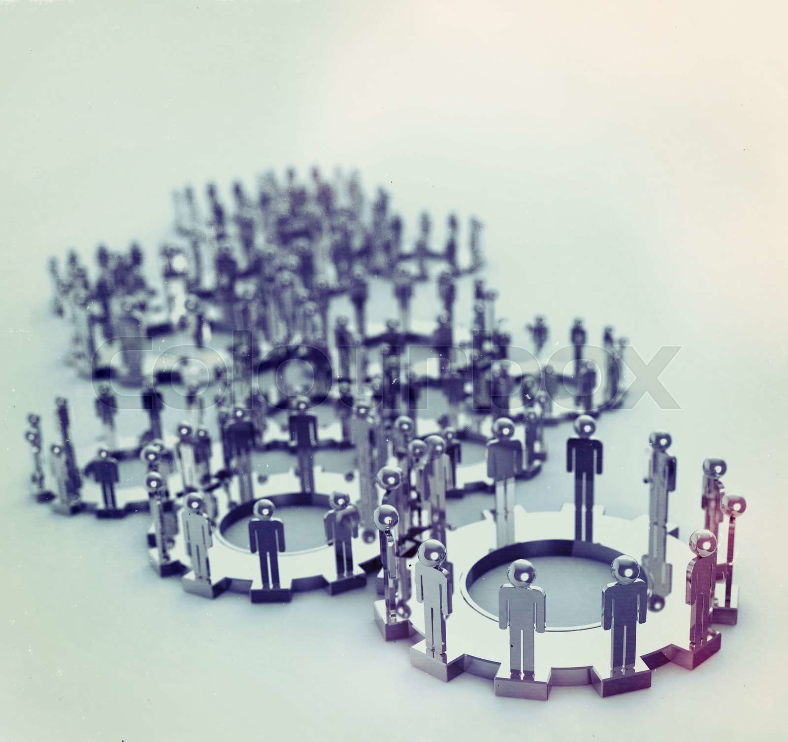 Model of 3d figures on connected cogs | Stock image | Colourbox