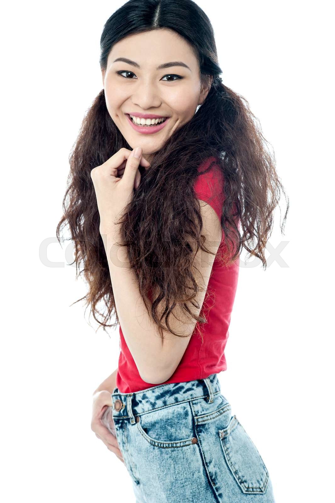 Cute slim girl posing over white | Stock image | Colourbox
