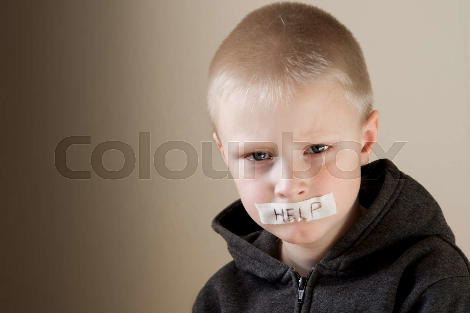 Abused crying child, help | Stock image | Colourbox