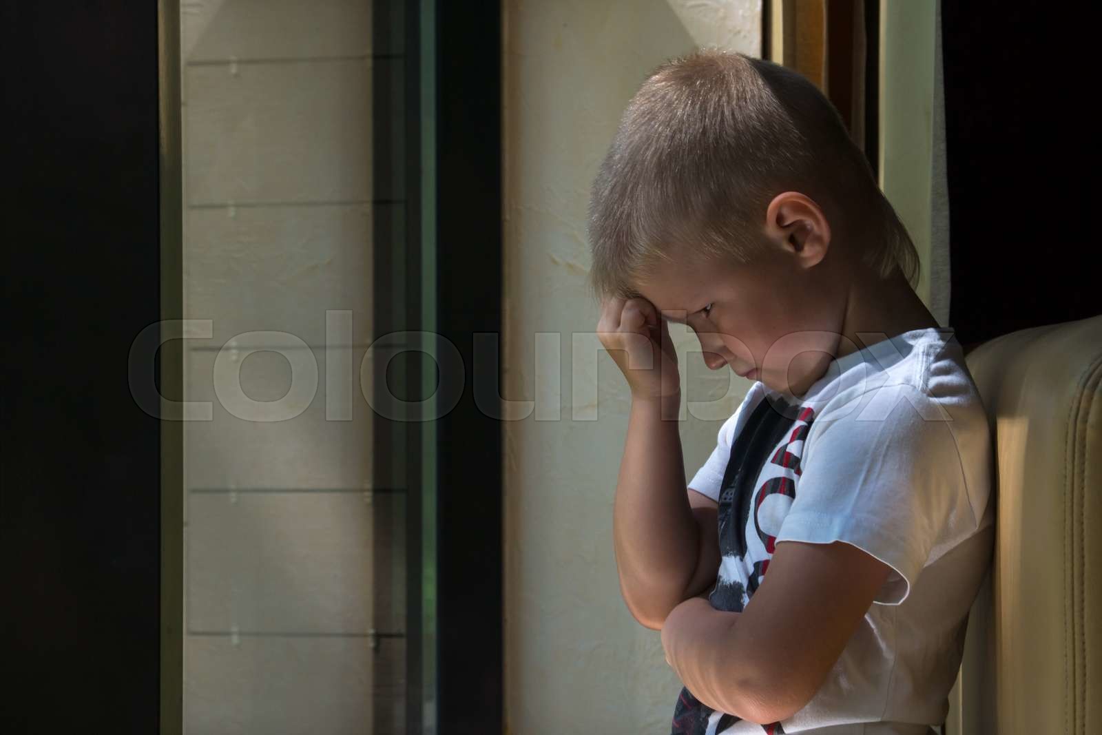 Sad upset child | Stock image | Colourbox