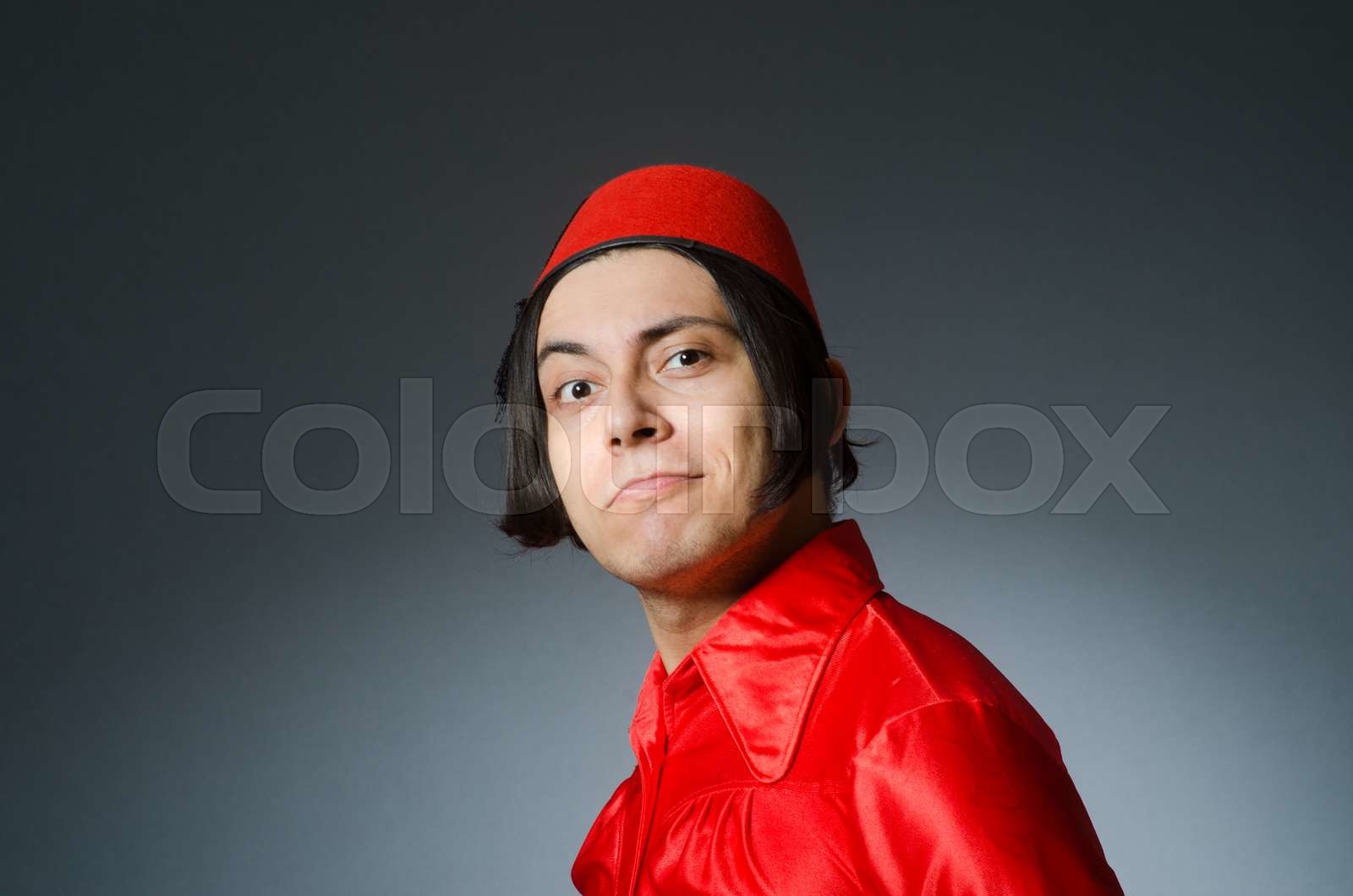 Man wearing red fez hat | Stock image | Colourbox