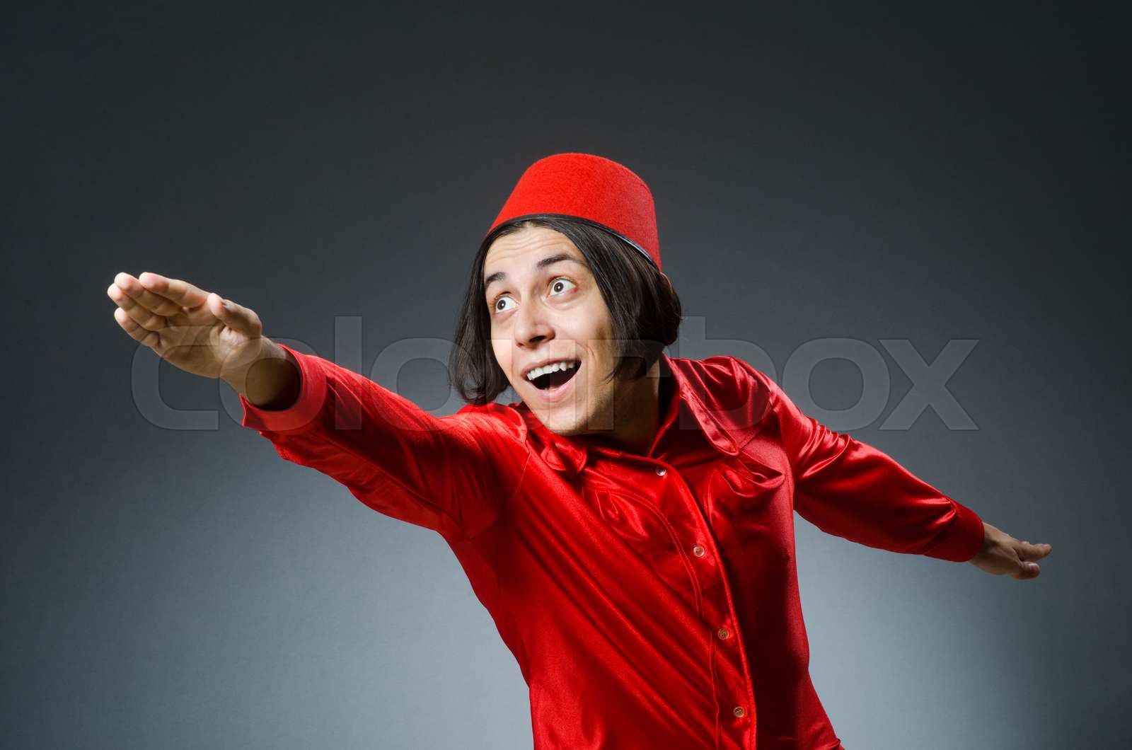 Man wearing red fez hat | Stock image | Colourbox
