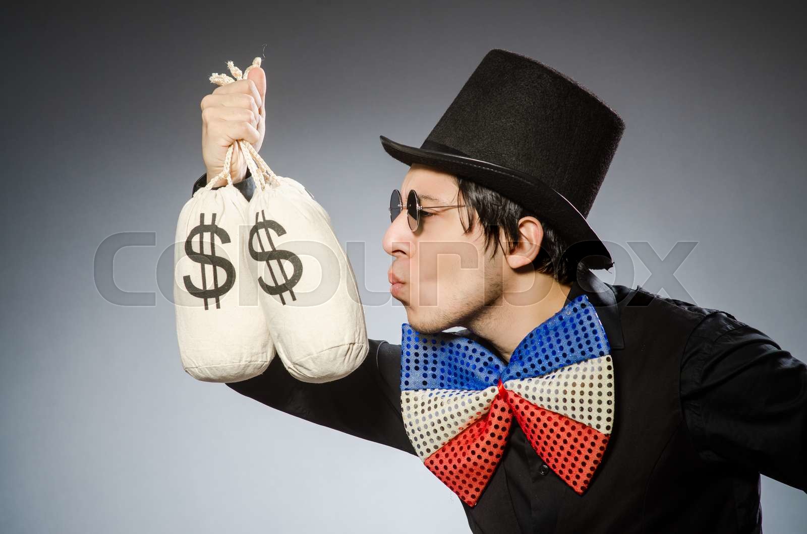 Funny man with money dollar sacks | Stock image | Colourbox