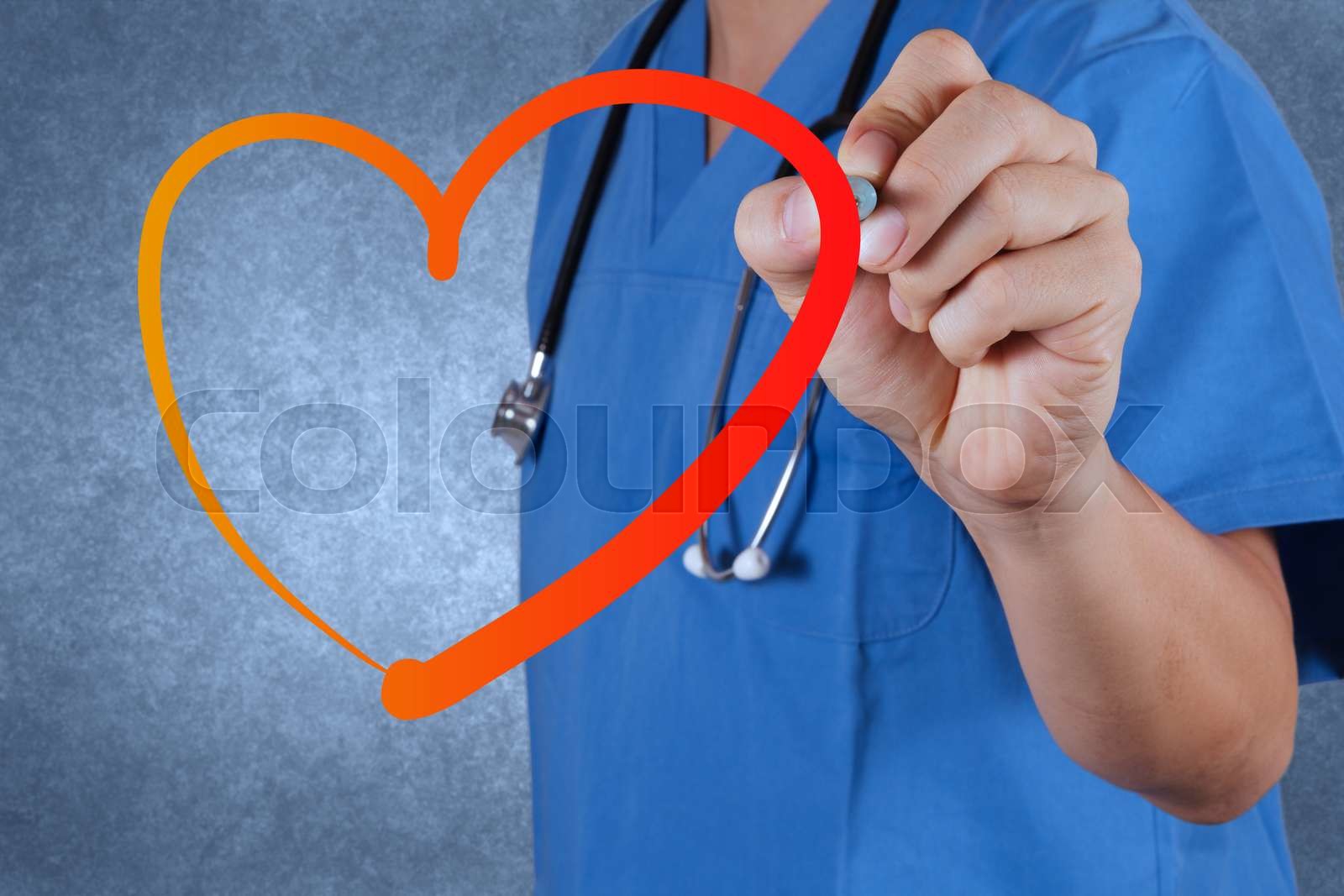 doctor drawing heart symbol | Stock image | Colourbox
