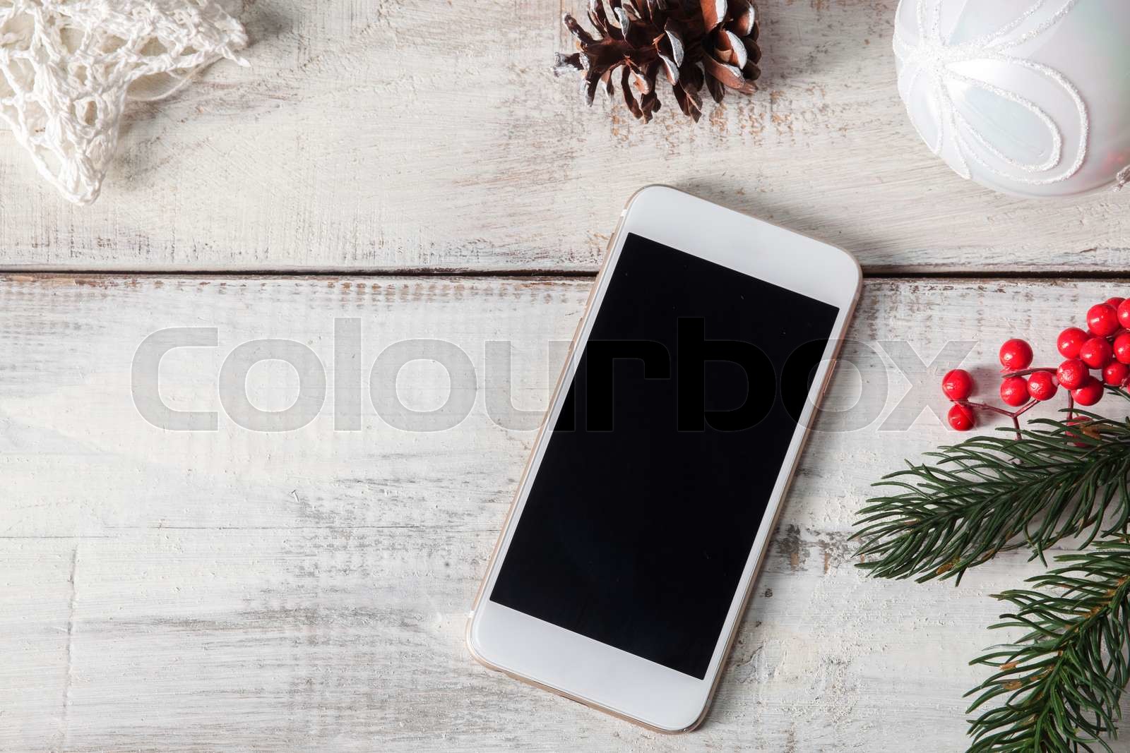 The wooden table with a phone | Stock image | Colourbox