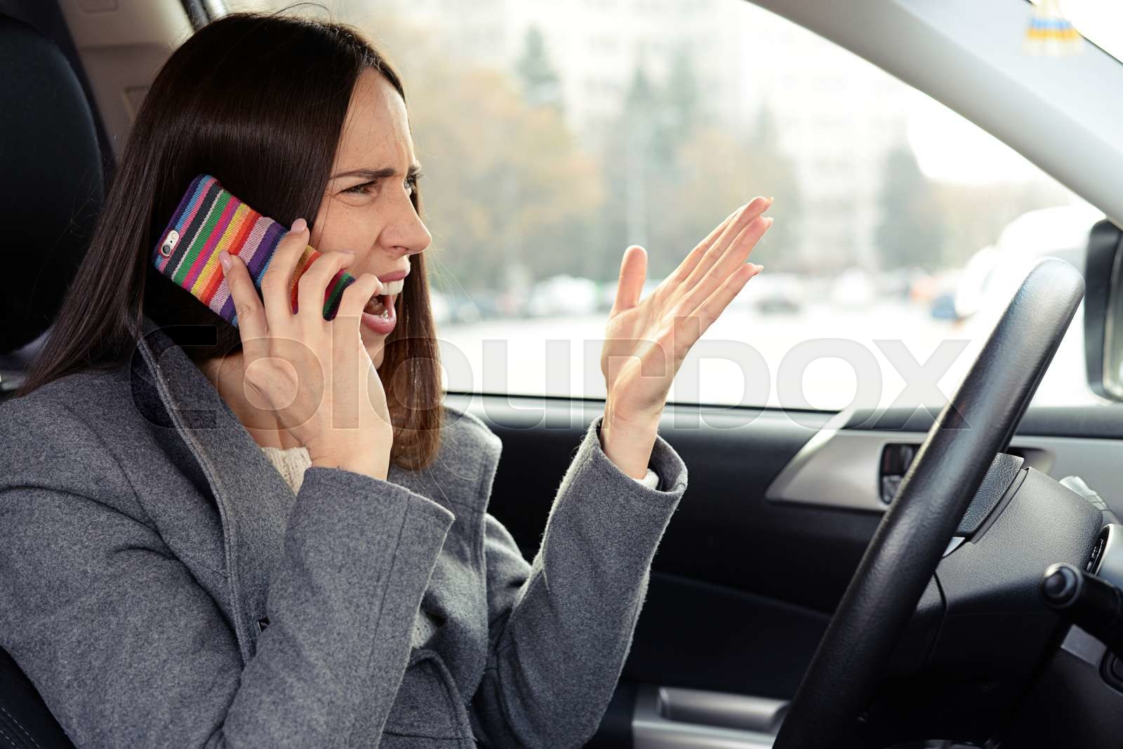 emotional woman driving the car | Stock image | Colourbox