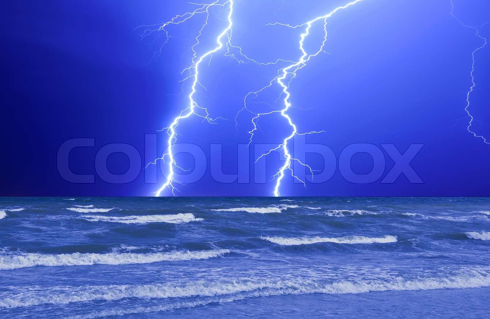 Thunderstorm and perfect Lightning over the wave ocean | Stock image ...