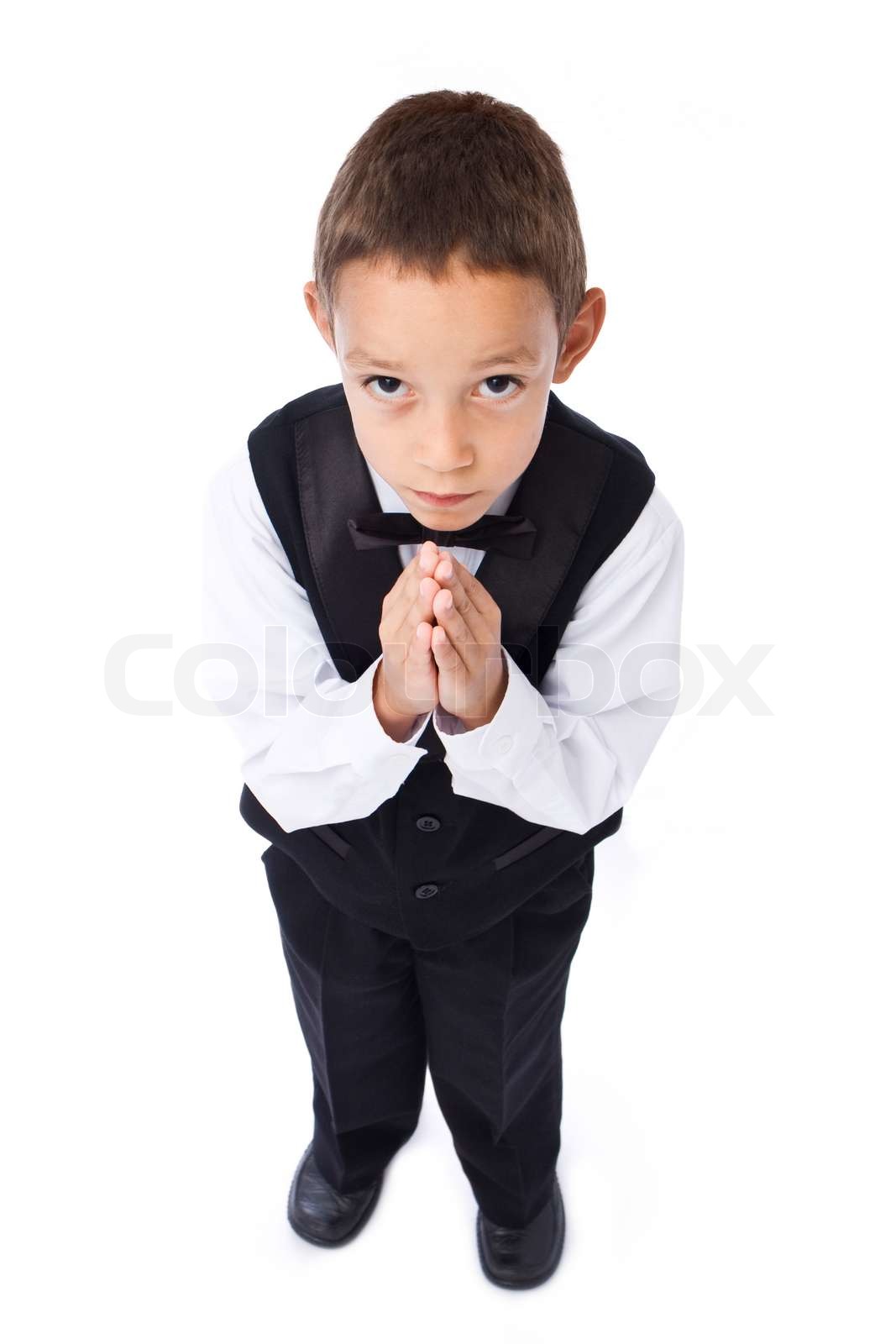 little boy praying isolated on white | Stock image | Colourbox