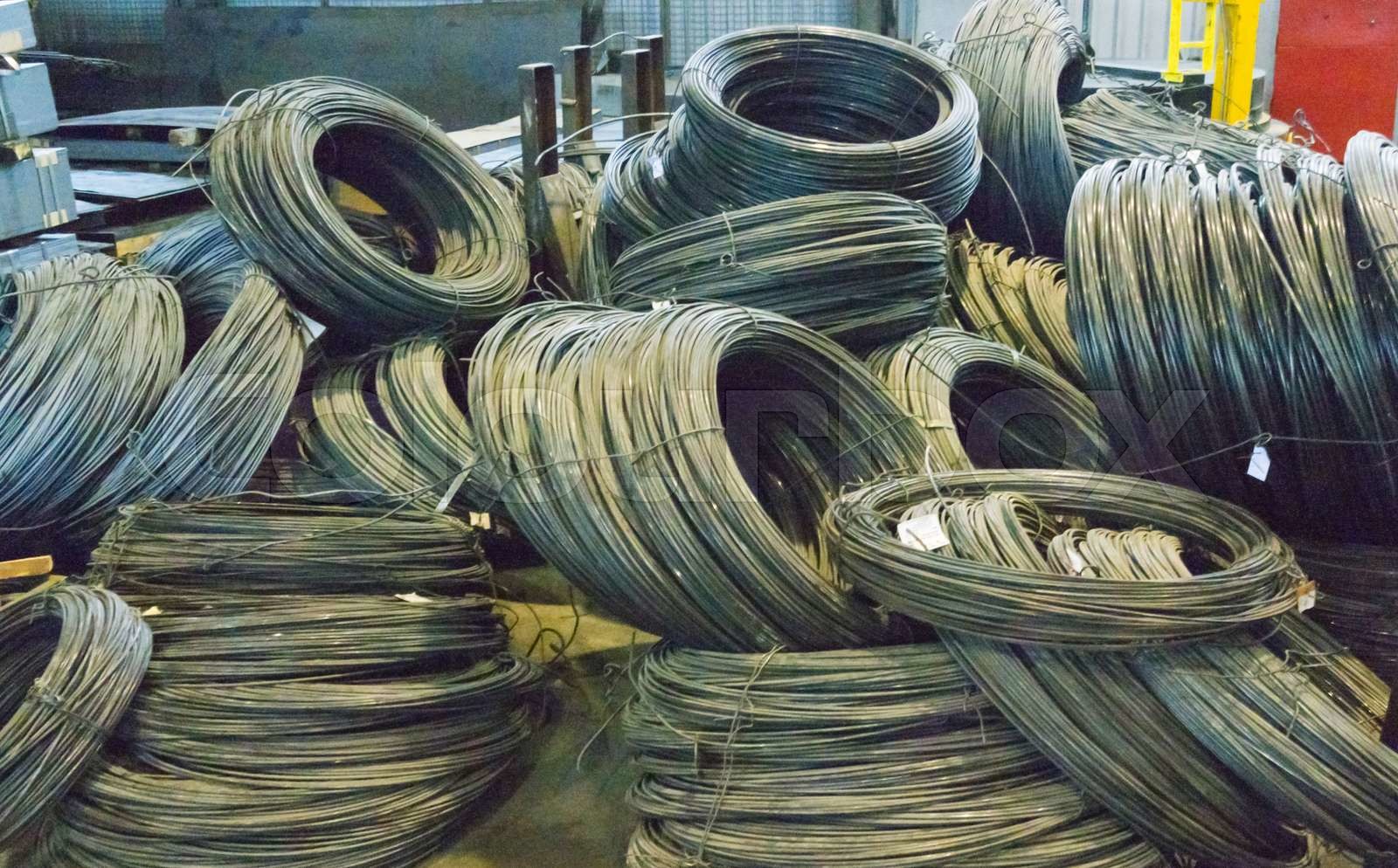 coils of steel wires in factory warehouse | Stock image | Colourbox