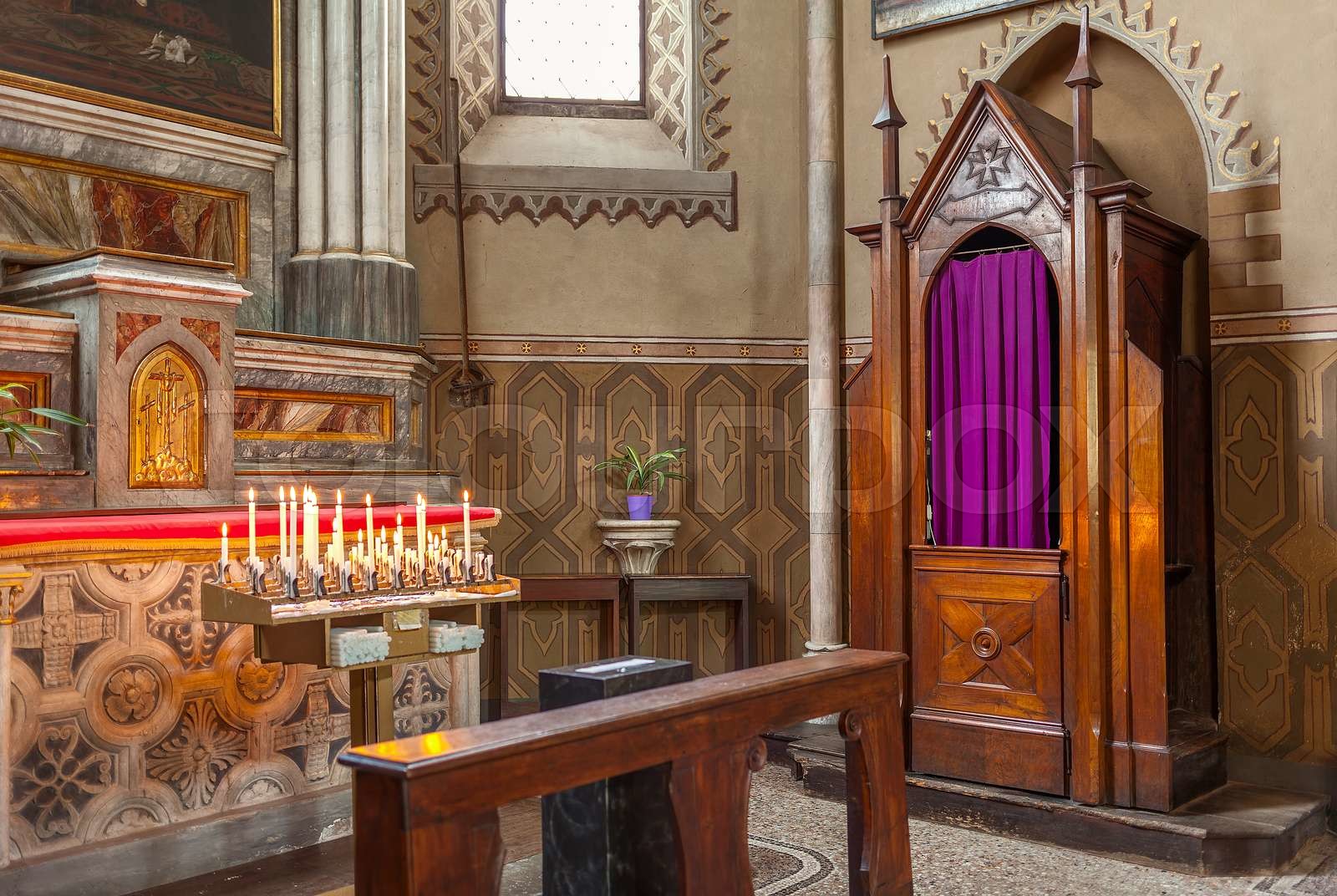 Confessional and altar with candles in the church. | Stock image ...