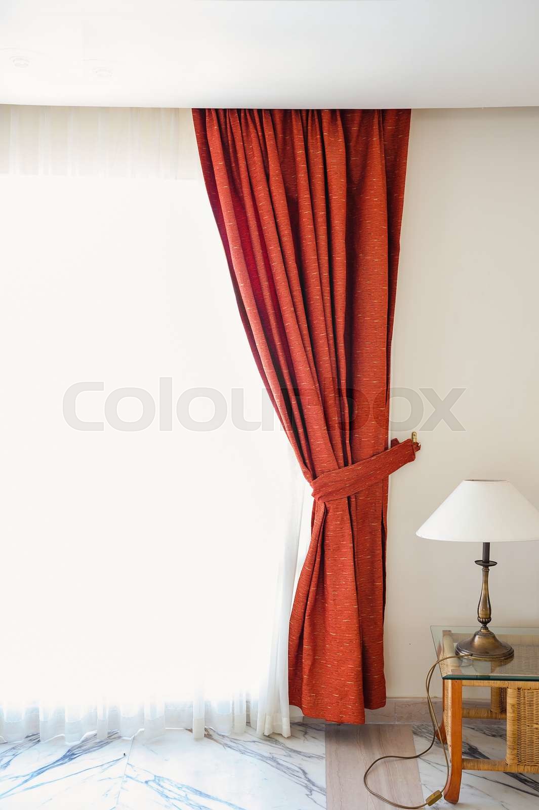 Red curtains in a hotel room | Stock image | Colourbox