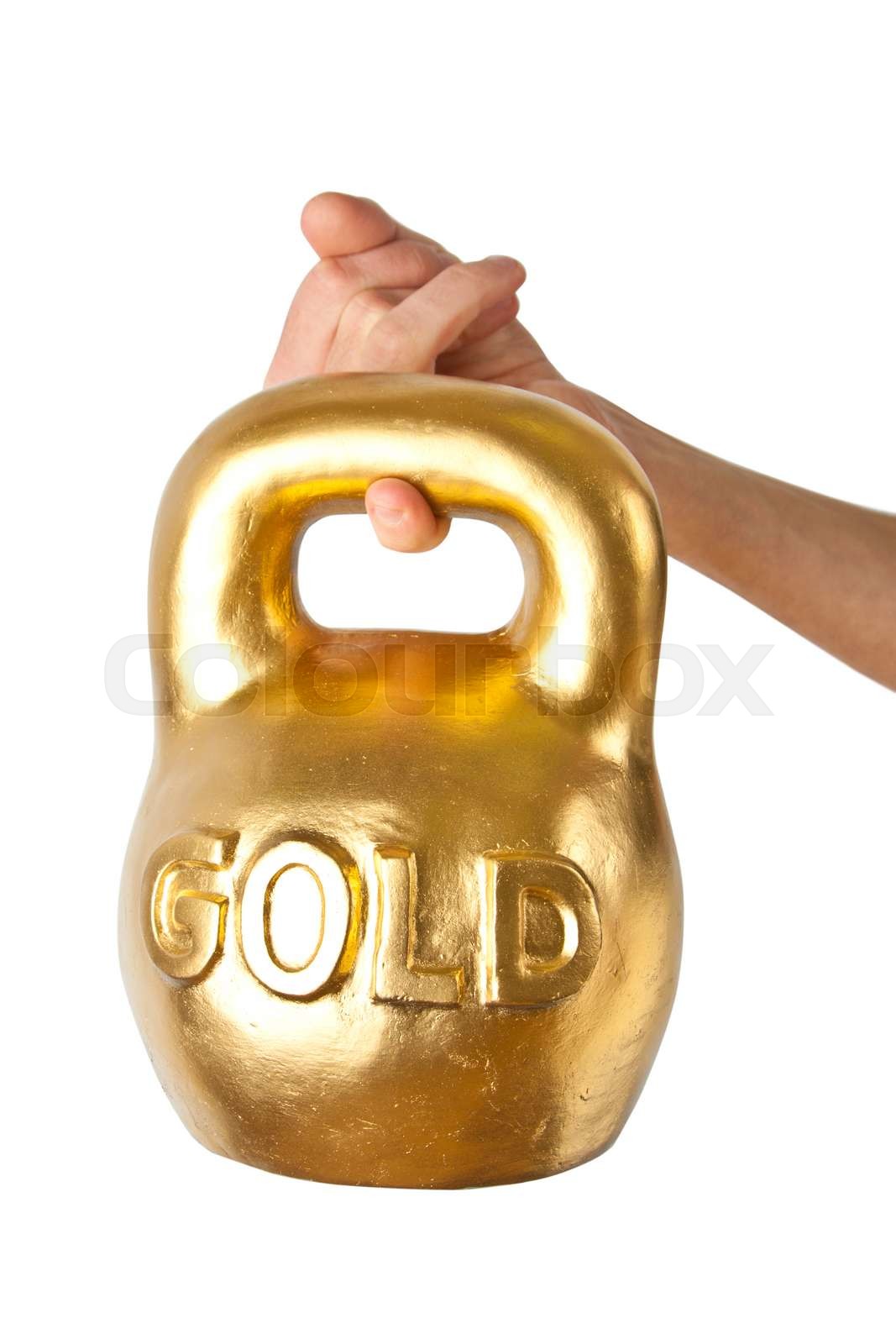A hand holding heavy weight of gold | Stock image | Colourbox