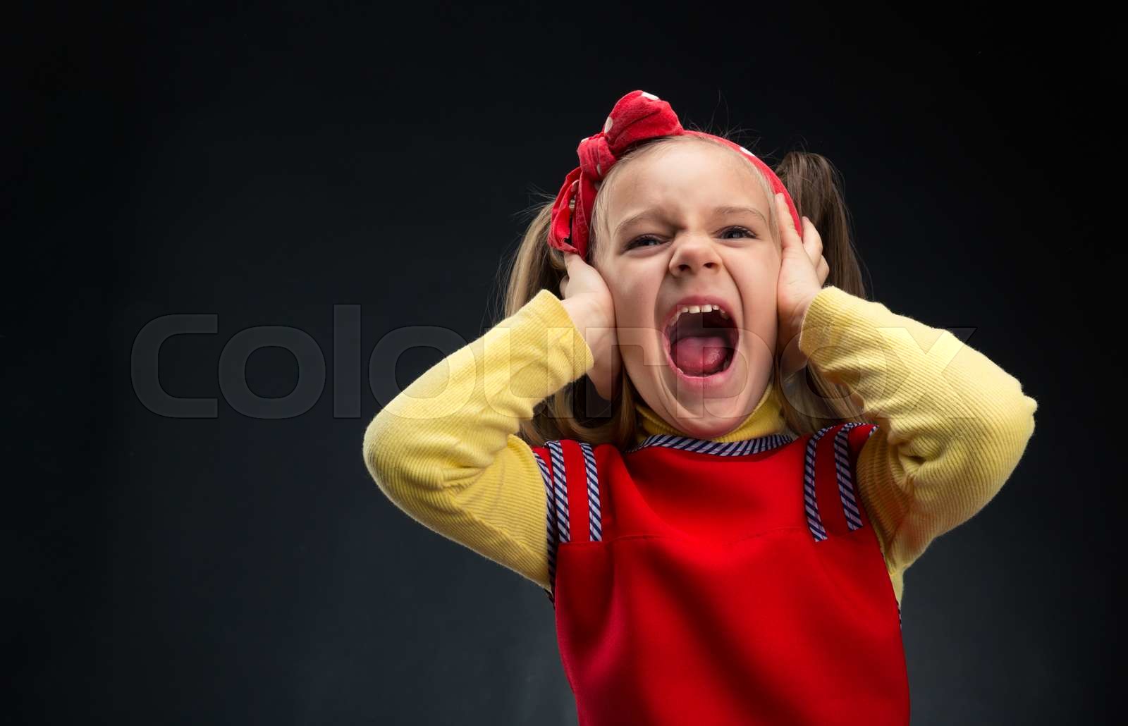 Little girl screaming | Stock image | Colourbox