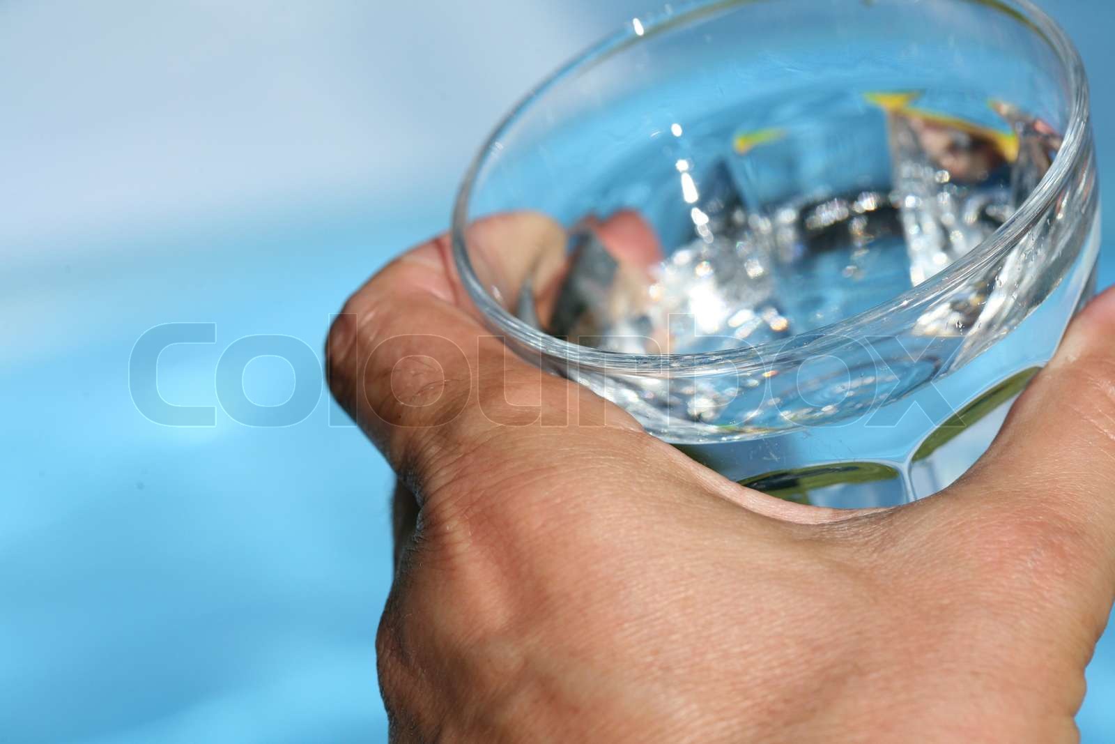 hand holding a water glass | Stock image | Colourbox