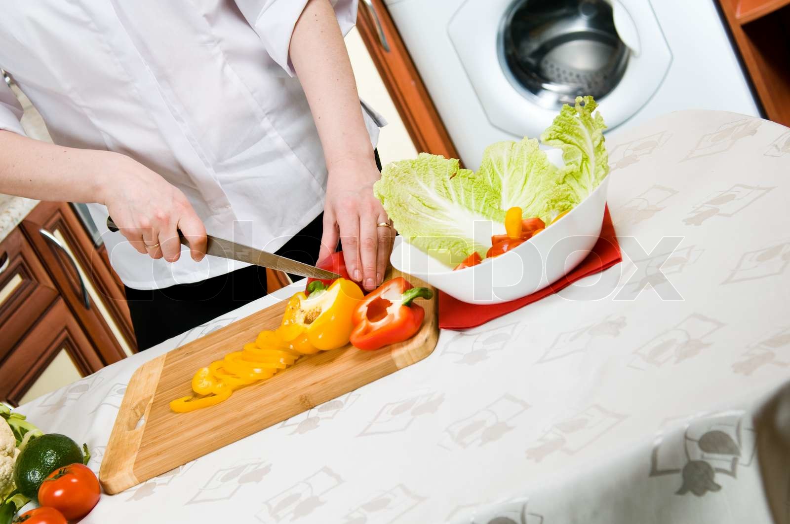 Cutting of vegetables on a chopping board | Stock image | Colourbox