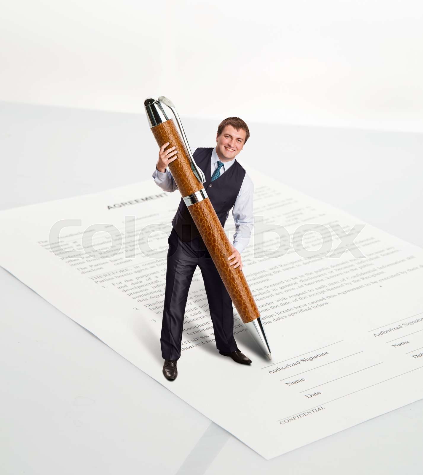 Man with a big pen | Stock image | Colourbox