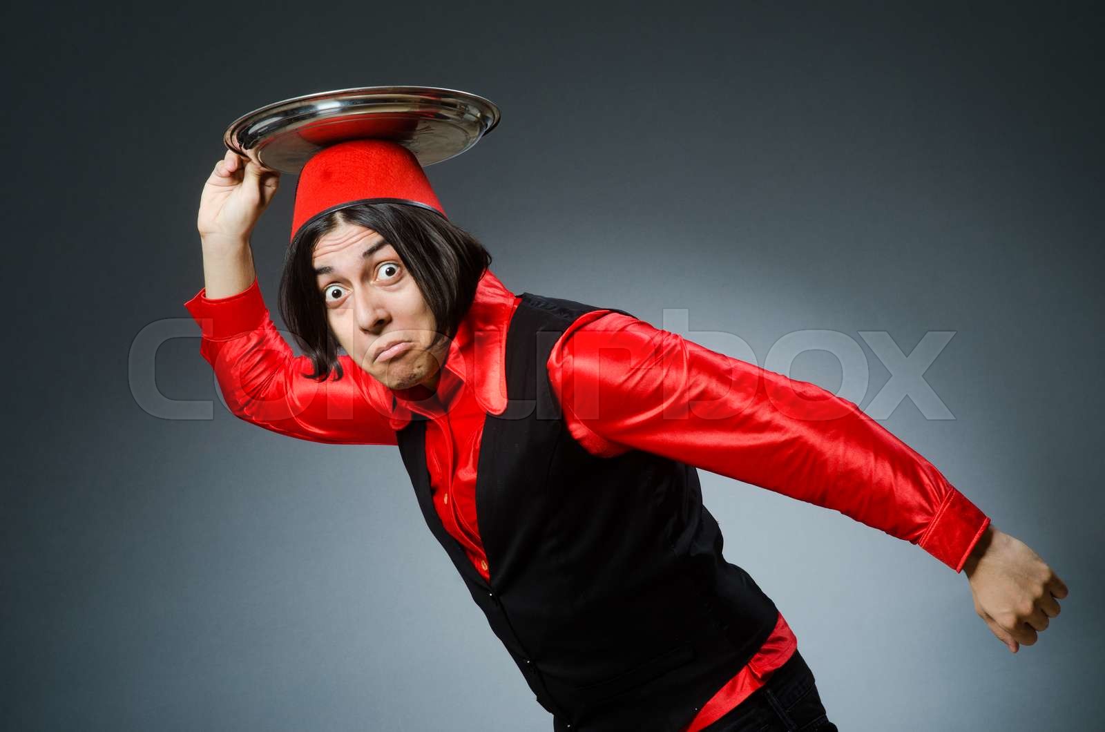 Man wearing red fez hat | Stock image | Colourbox