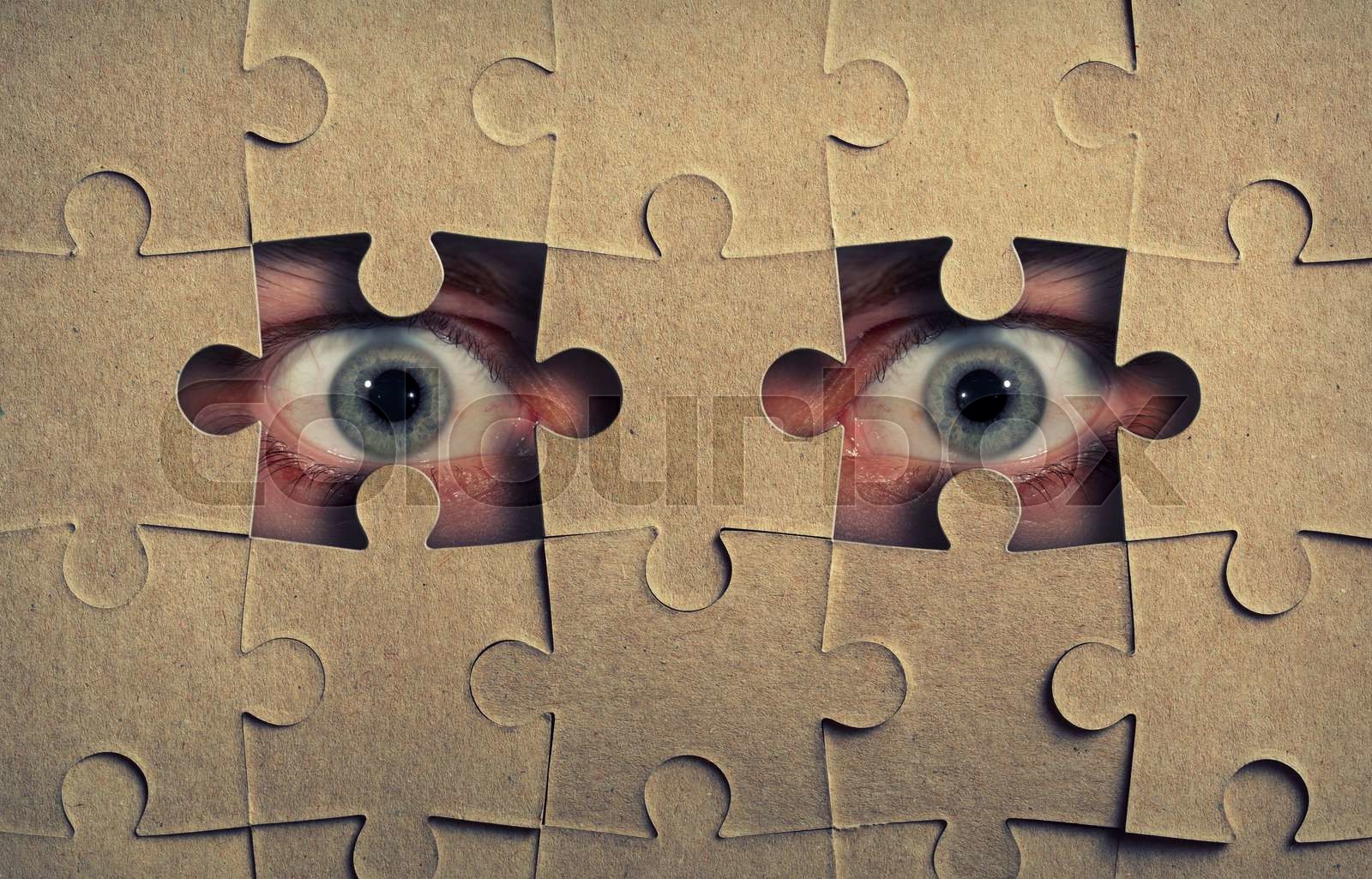Eyes look out from the puzzle | Stock image | Colourbox