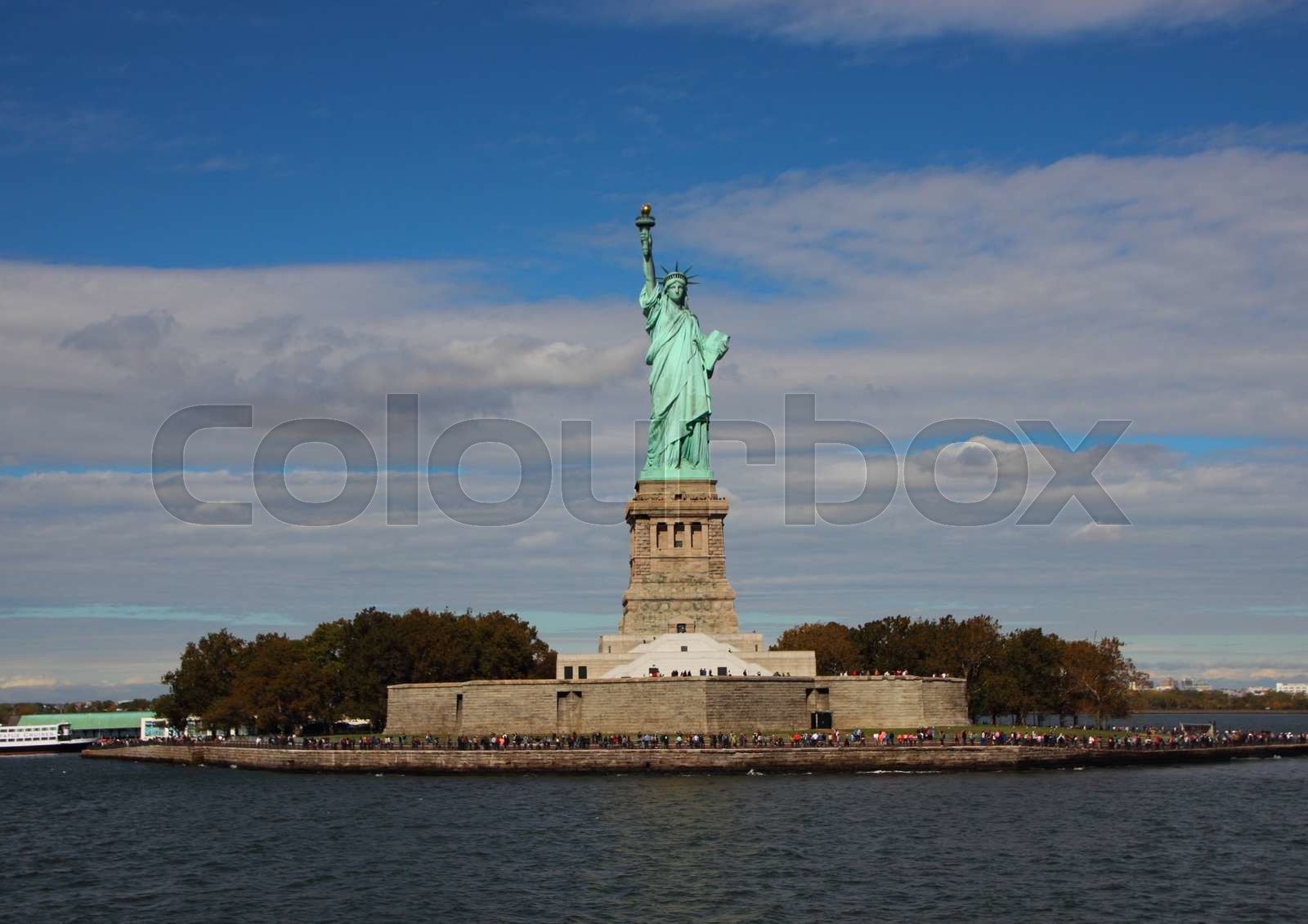 Liberty Island with Statue Front View and Clouds | Stock image | Colourbox