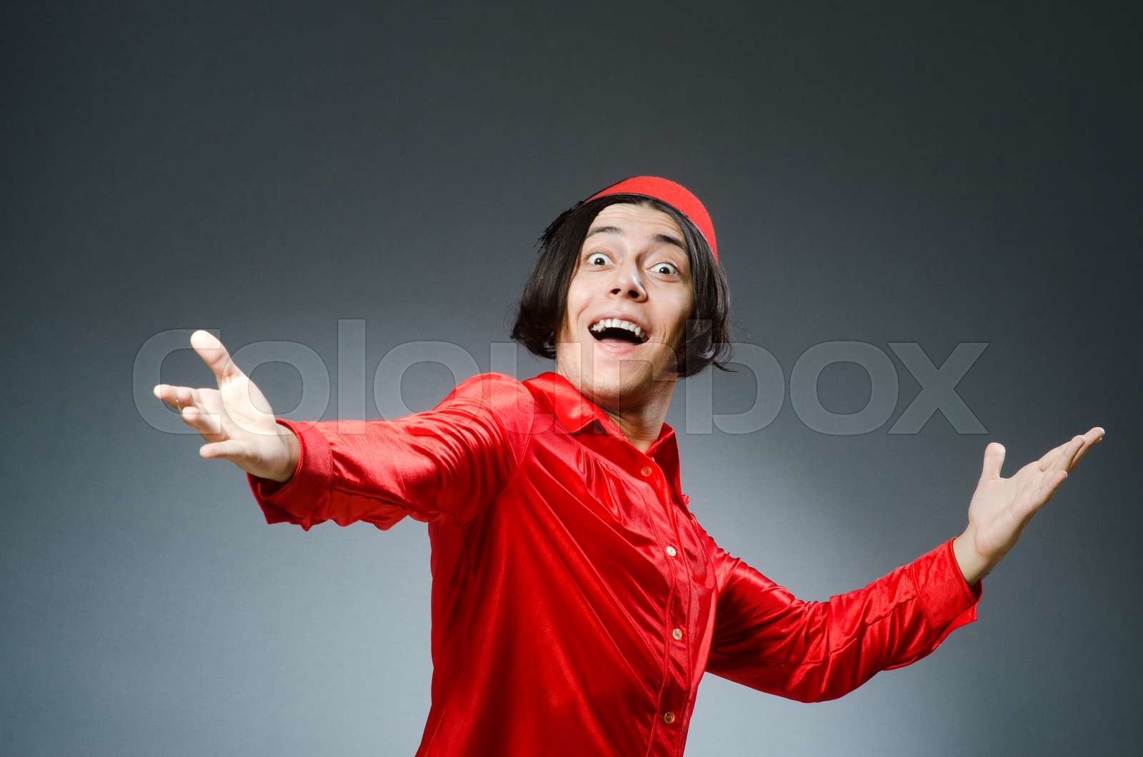 Man wearing red fez hat | Stock image | Colourbox