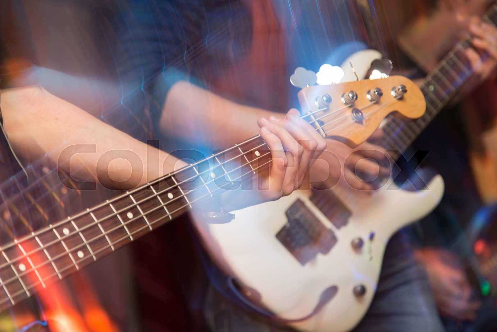 aggressive play guitar on stage | Stock image | Colourbox