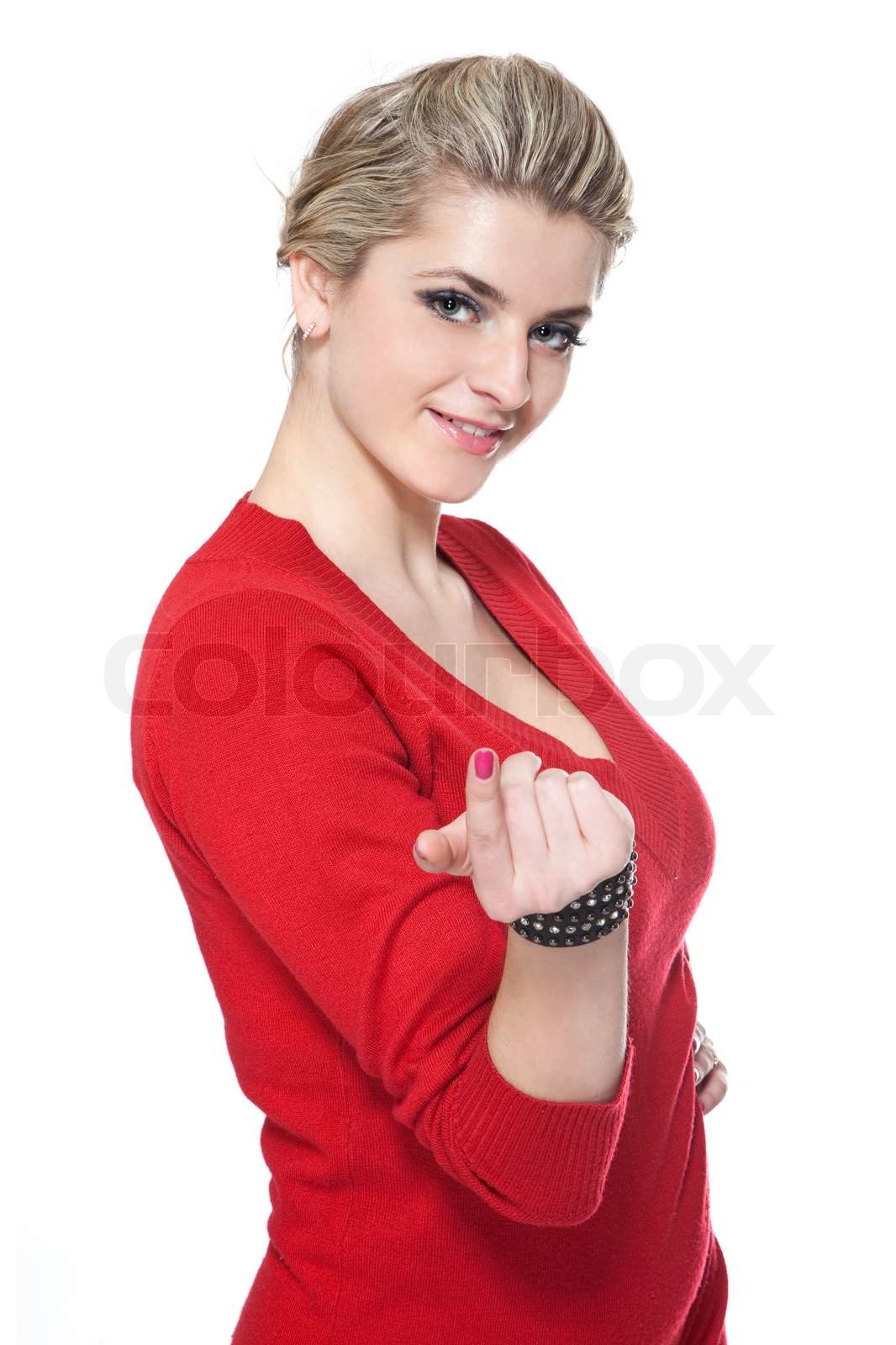 Beautifule woman in red dress inviting on white | Stock image | Colourbox