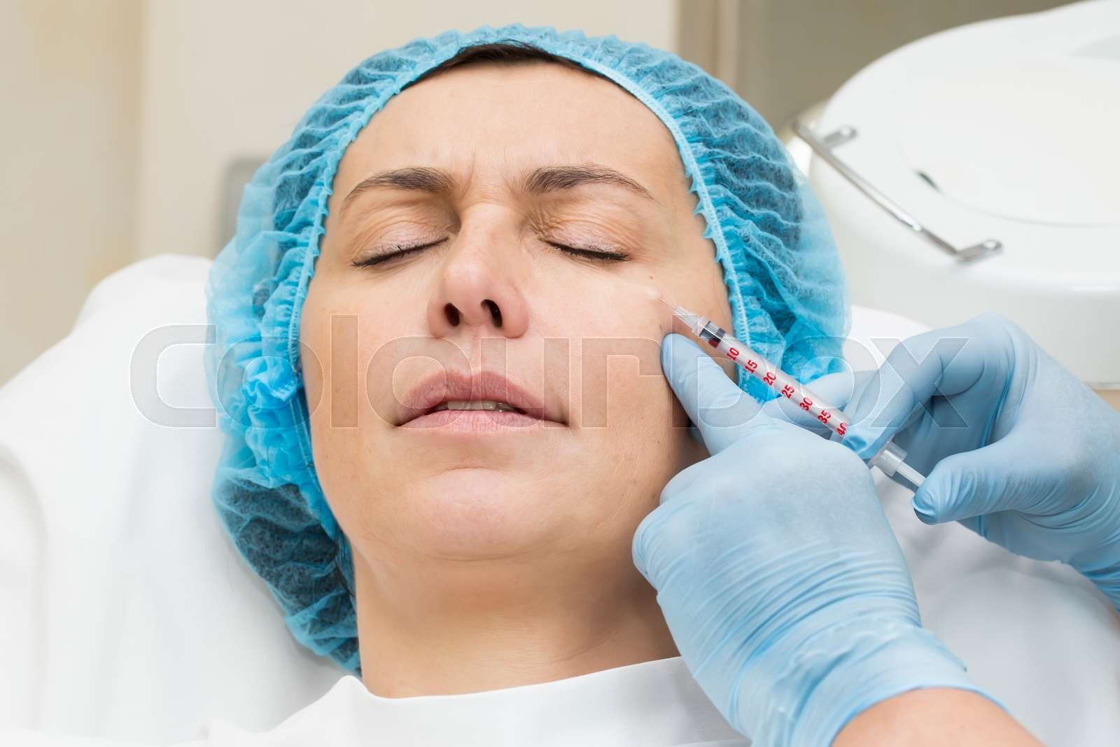 Cosmetic treatment with injection in a clinic | Stock image | Colourbox