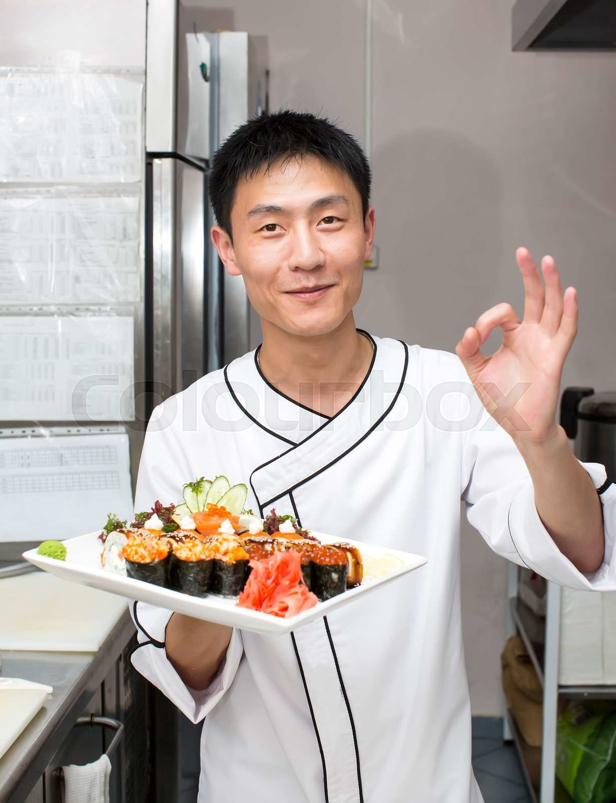 Japanese chef preparing a meal in a restaurant | Stock image | Colourbox