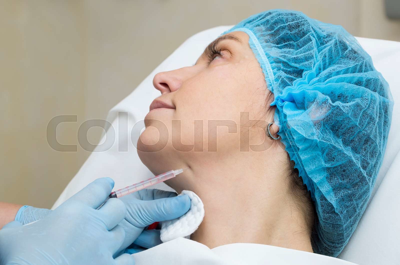 Cosmetic treatment with injection in a clinic | Stock image | Colourbox