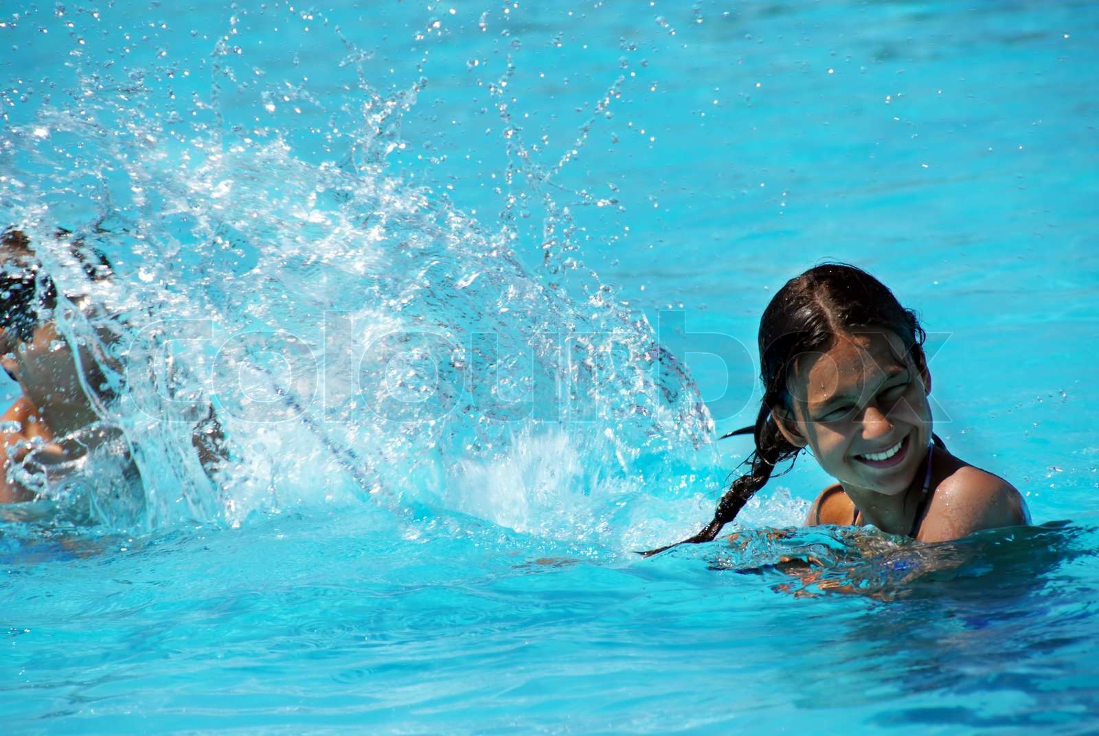 Kids having fun in swimming pool | Stock image | Colourbox