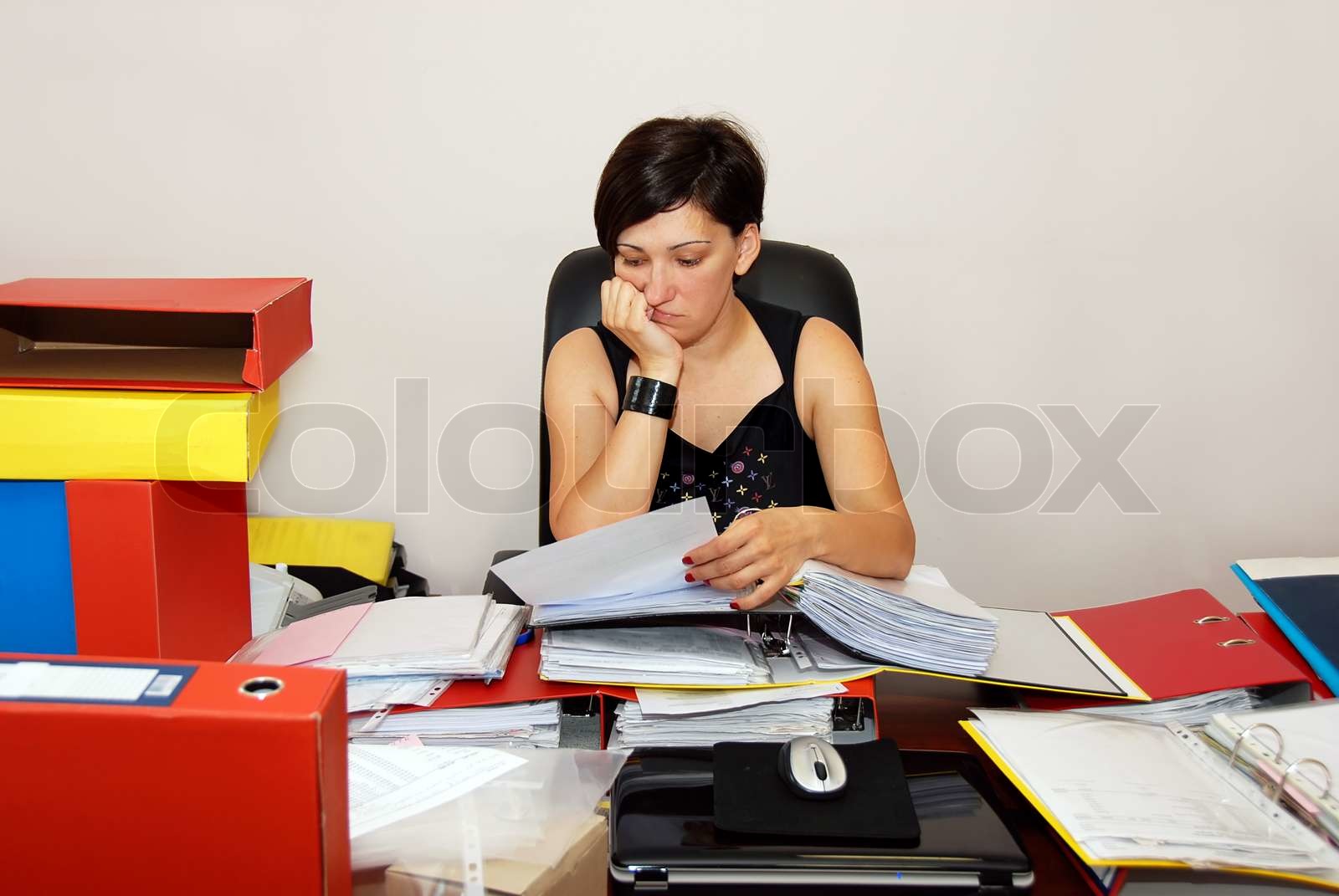 busy woman at the office desk working | Stock image | Colourbox