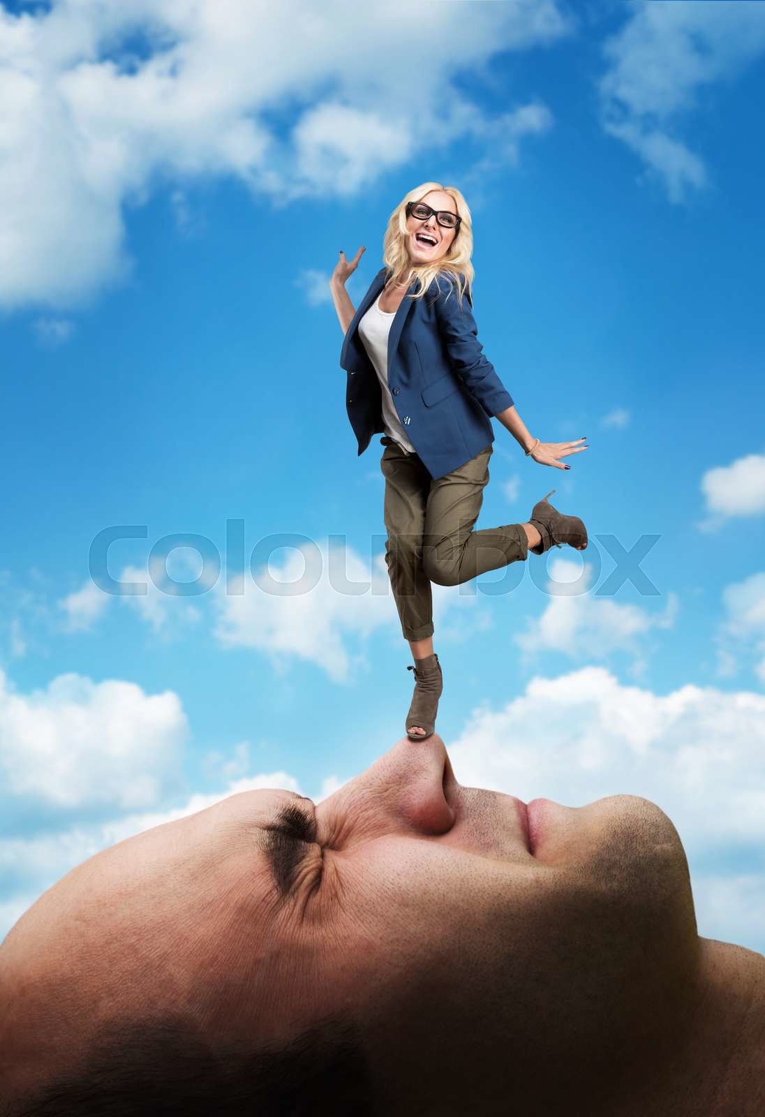 Woman standing on the man's face | Stock image | Colourbox