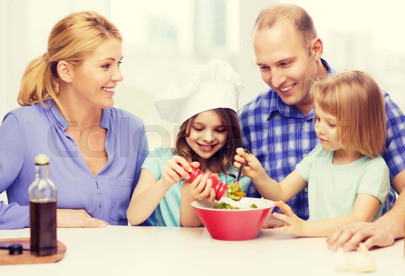 happy family with two kids making dinner at home | Stock image | Colourbox