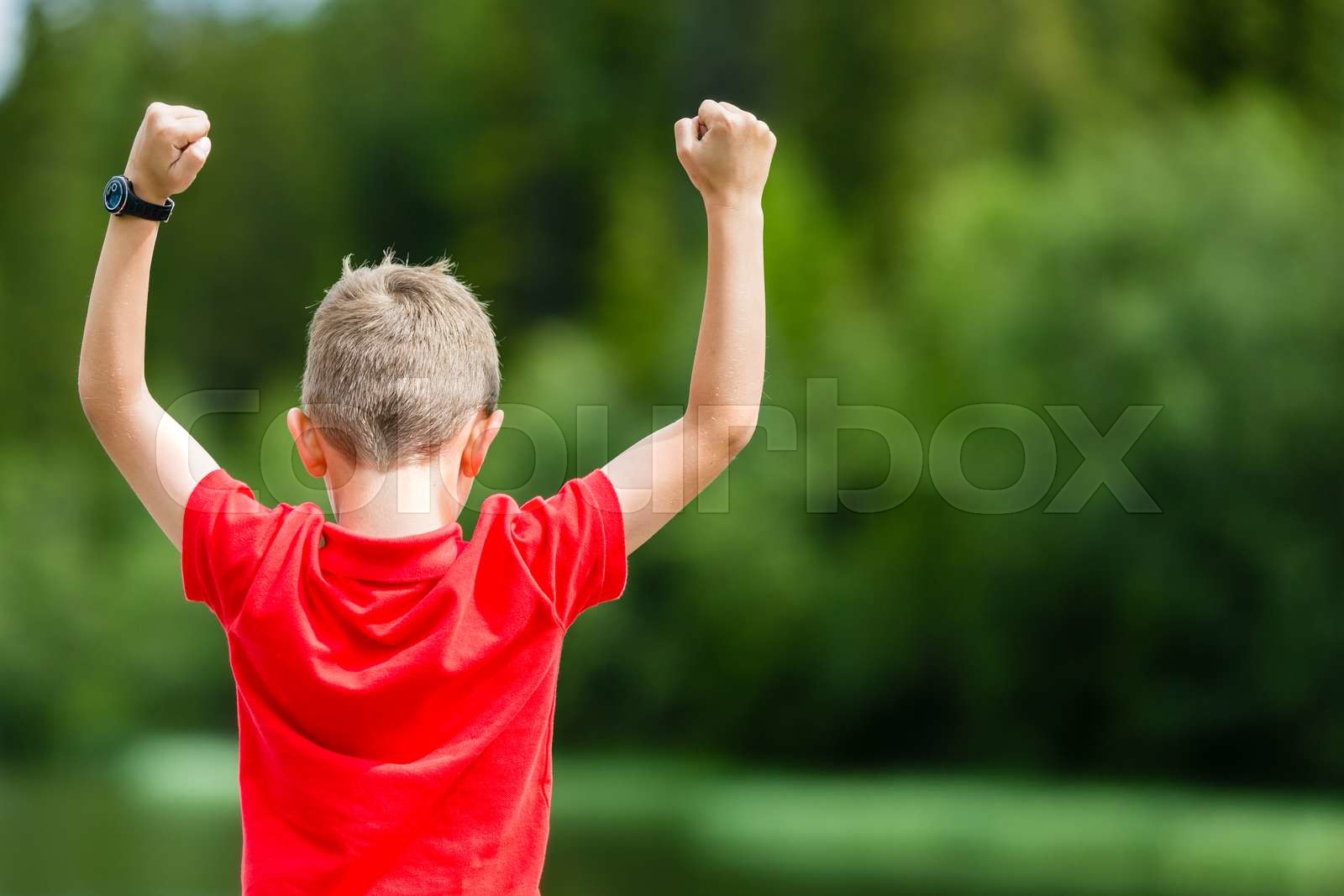 Boy with raised arms | Stock image | Colourbox