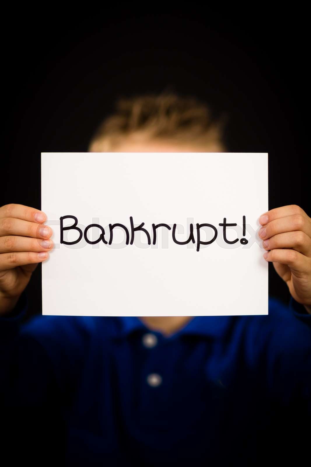 Child holding Bankrupt sign | Stock image | Colourbox