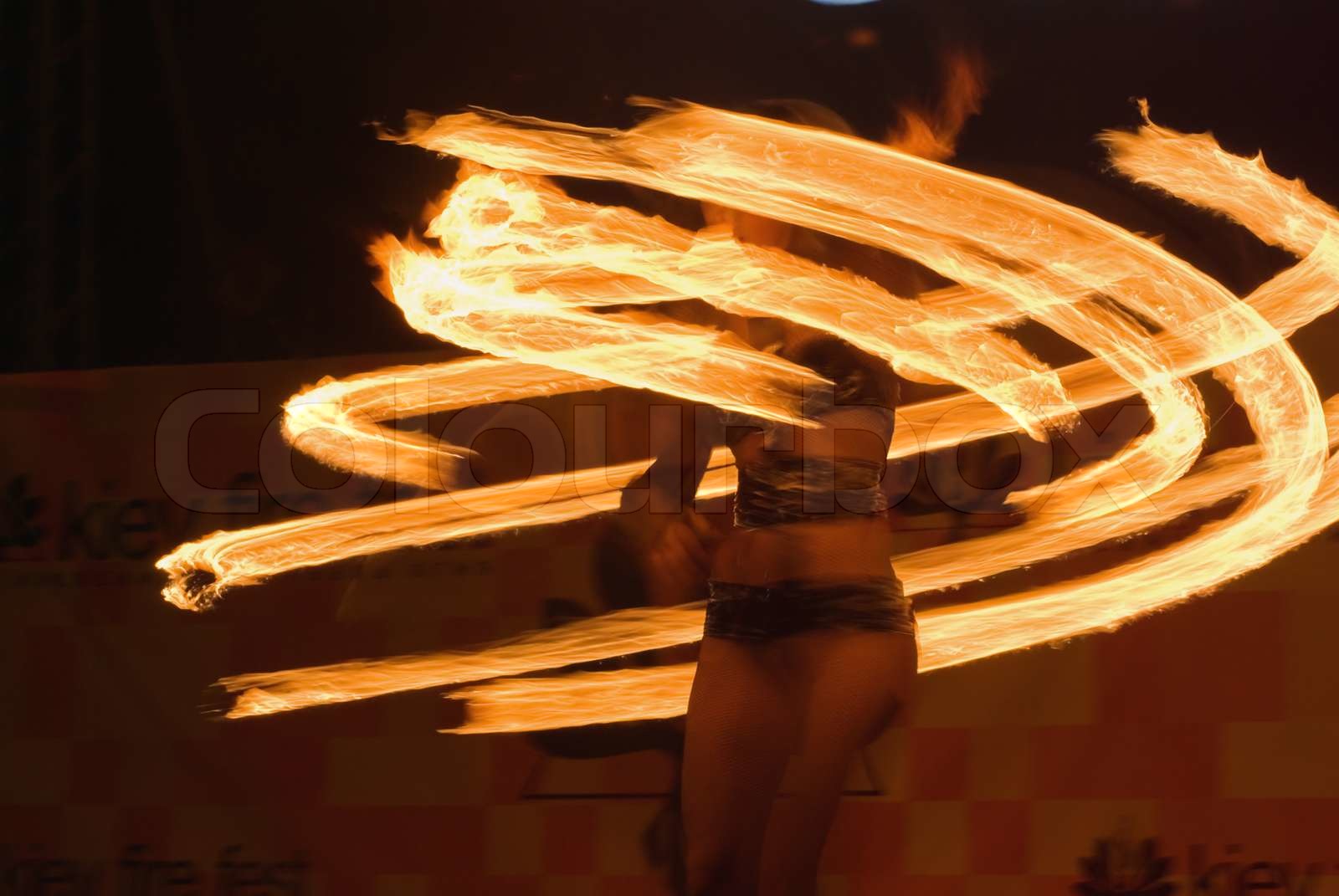 fire-show, woman in action with fire | Stock image | Colourbox