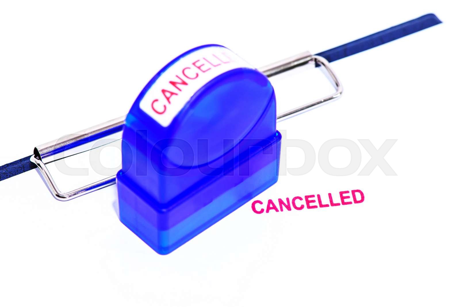 Red cancelled stamp on white paper with rubber stamper and clipb ...